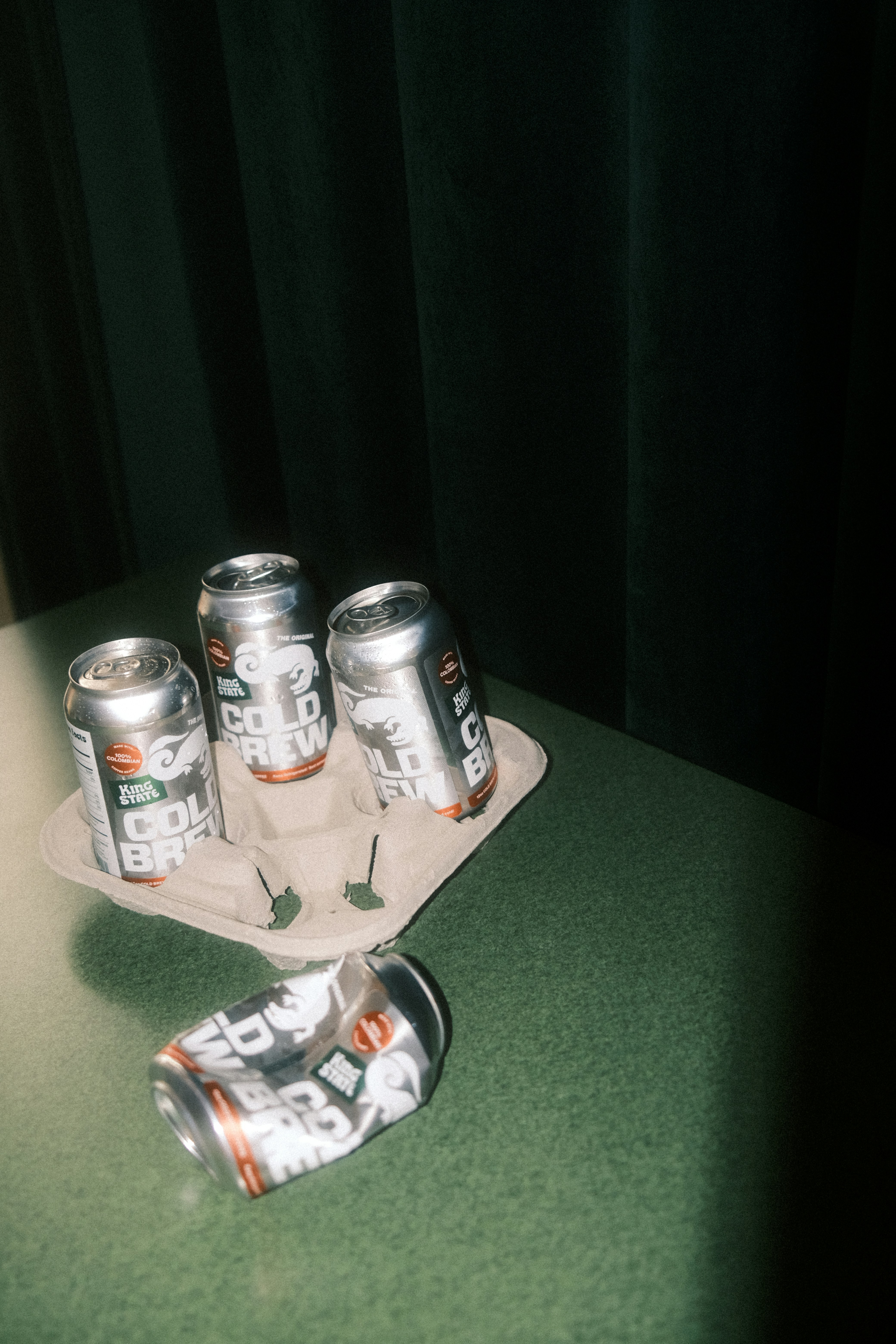 A group of cans of beer sitting on top of a counter photo – Free Green ...