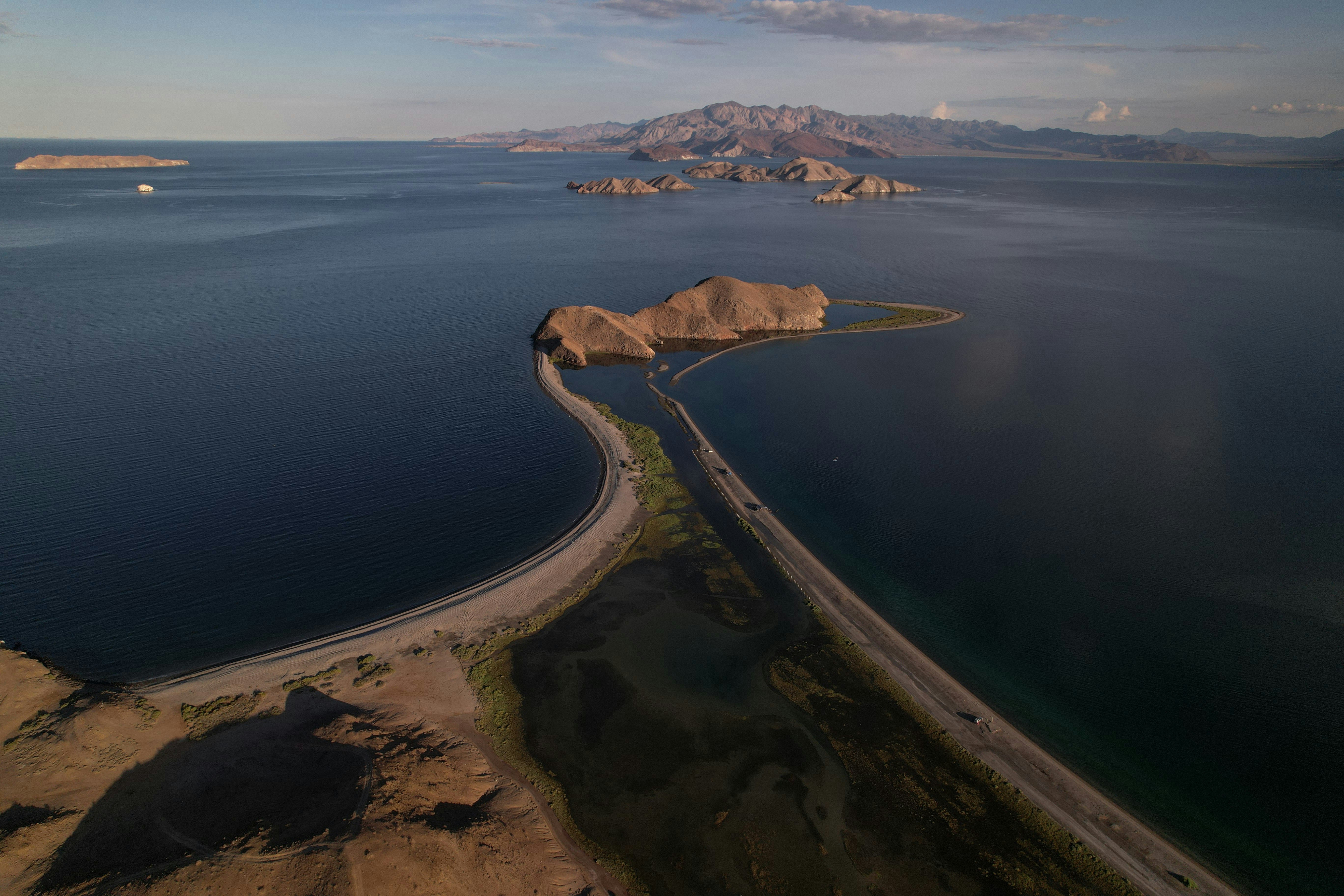 Meander Bridge: Aerial View of a Narrow Coastal Causeway