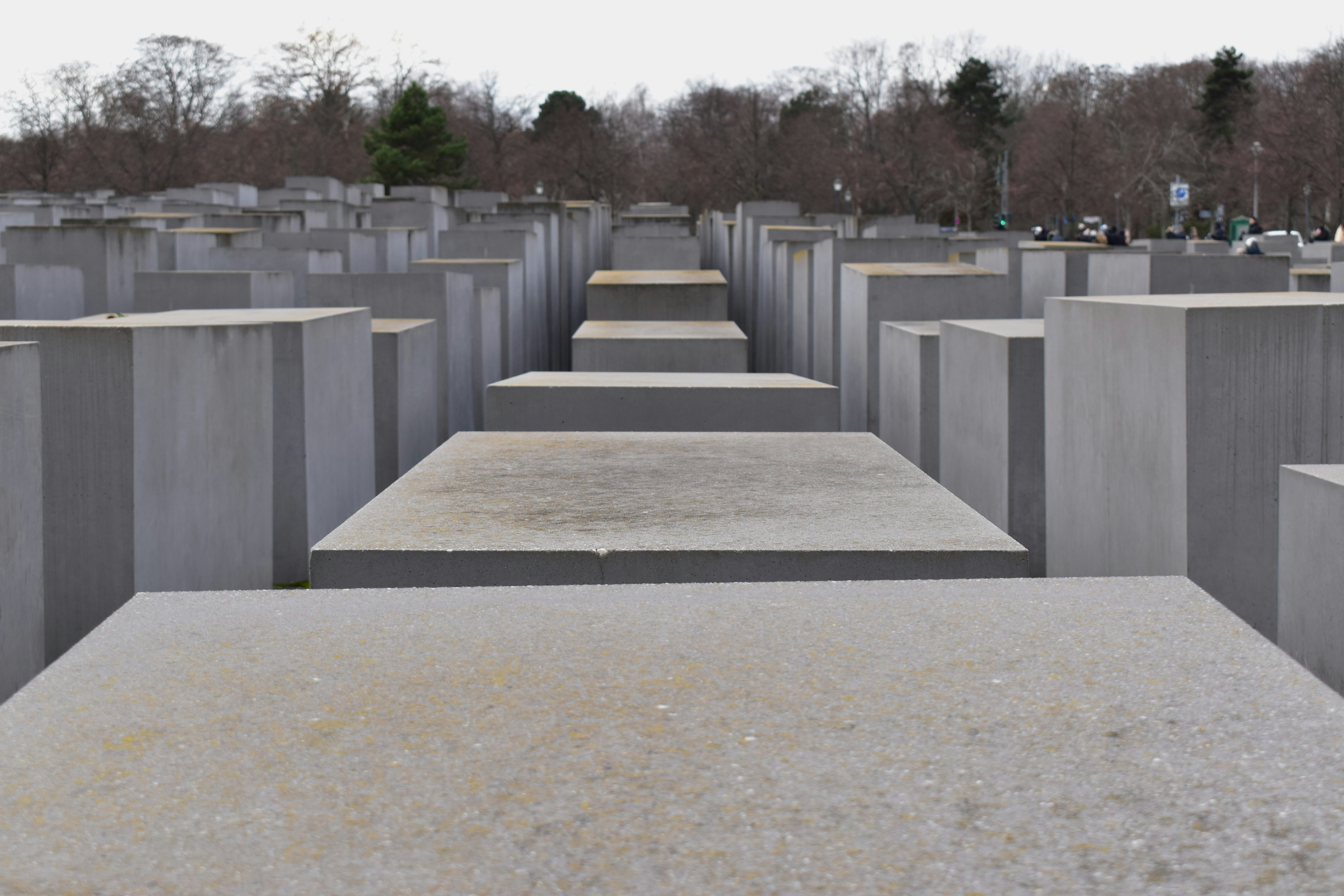 a group of cement benches sitting next to each other