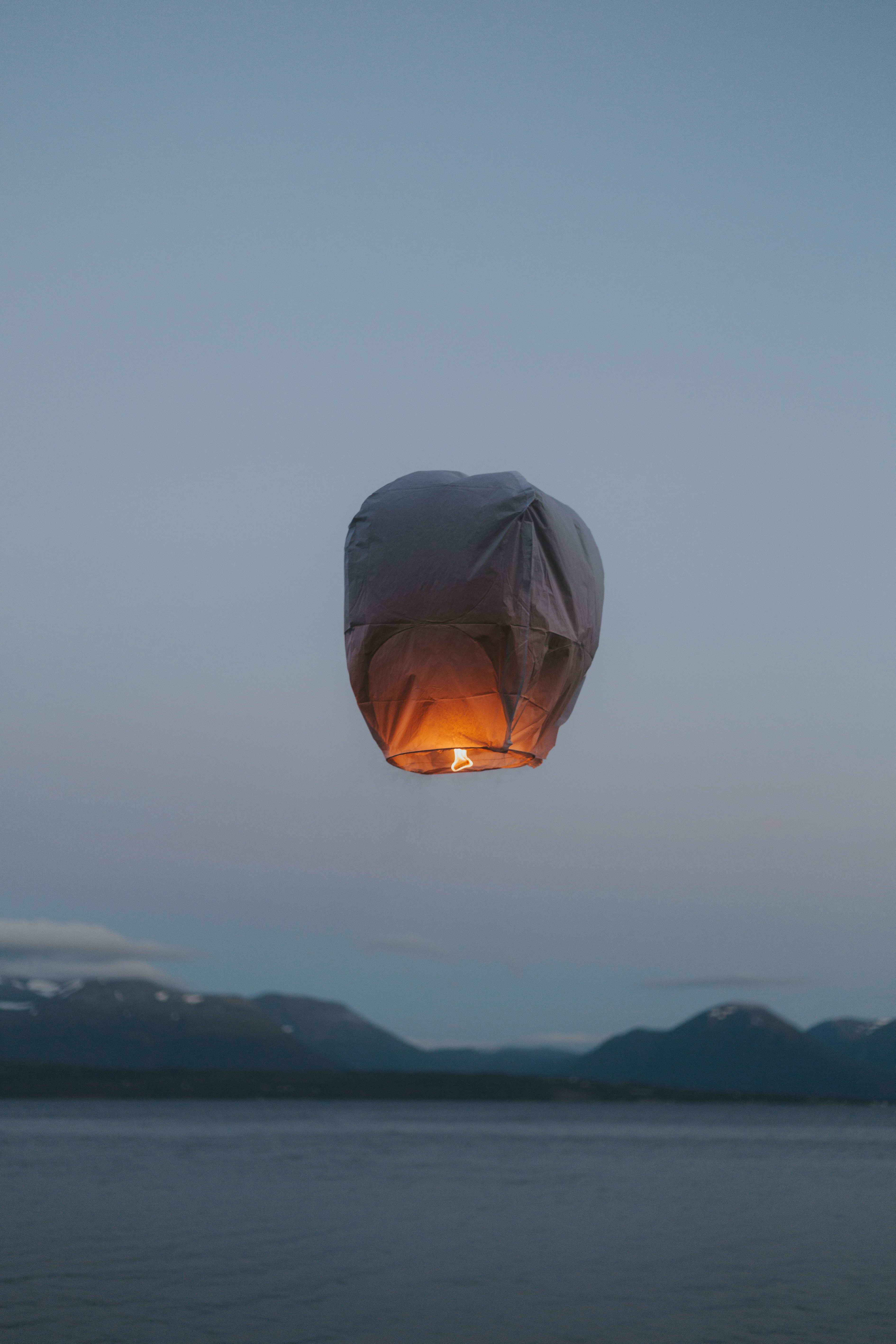 Floating Lantern Over a Quiet Fjord