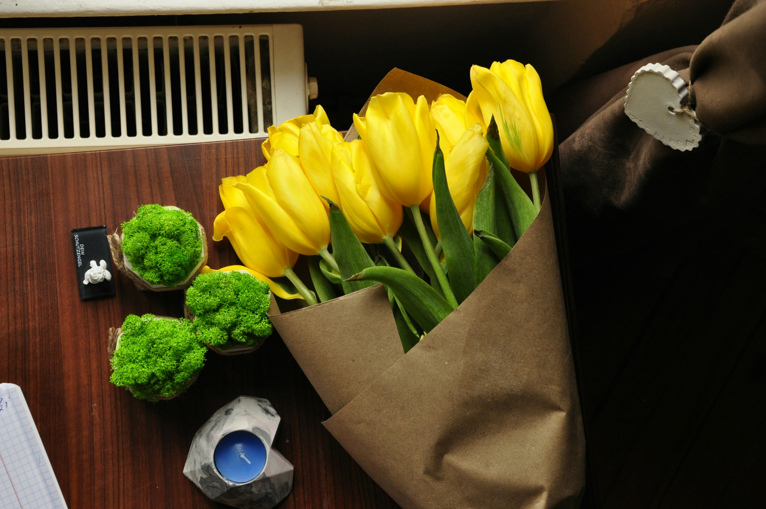 Sunlit Tulip Bouquet on a Walnut Desk with Moss and Craft Accents