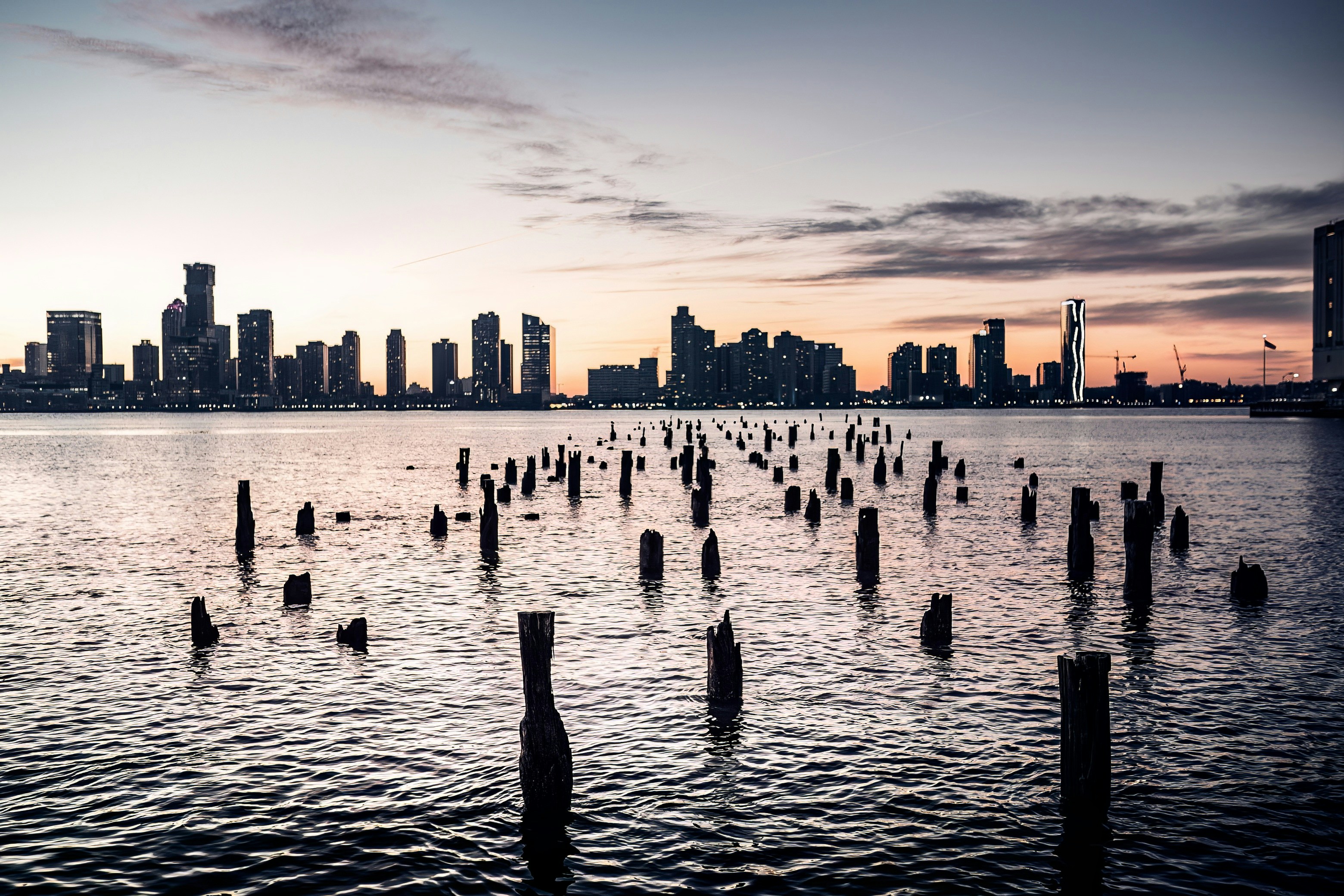 Sunset Skyline Through a Field of Silent Pilings