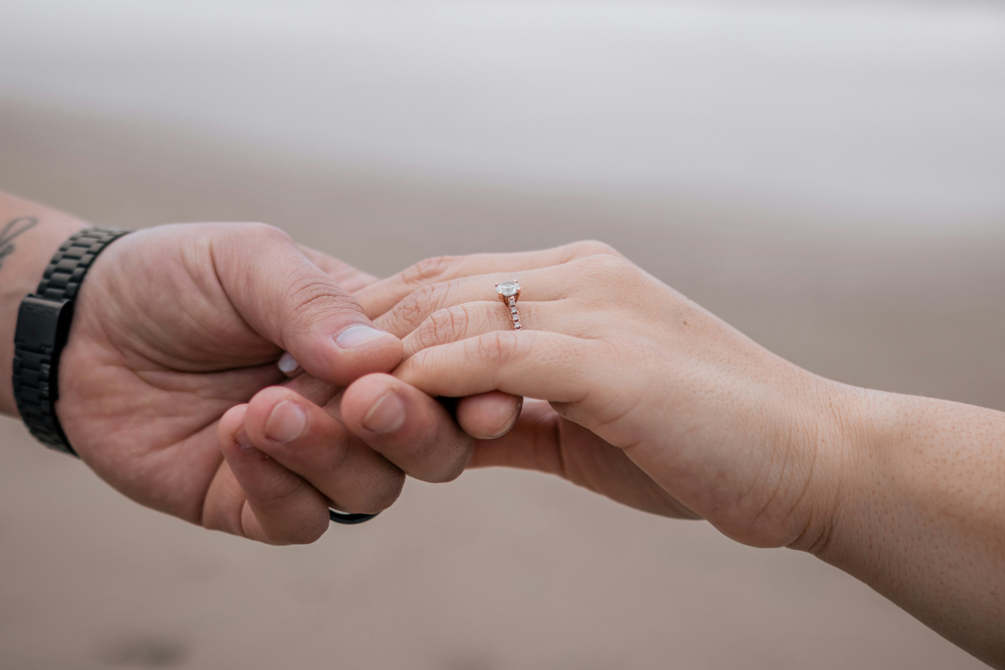 A close up of two people holding hands photo – Free Finger Image on ...