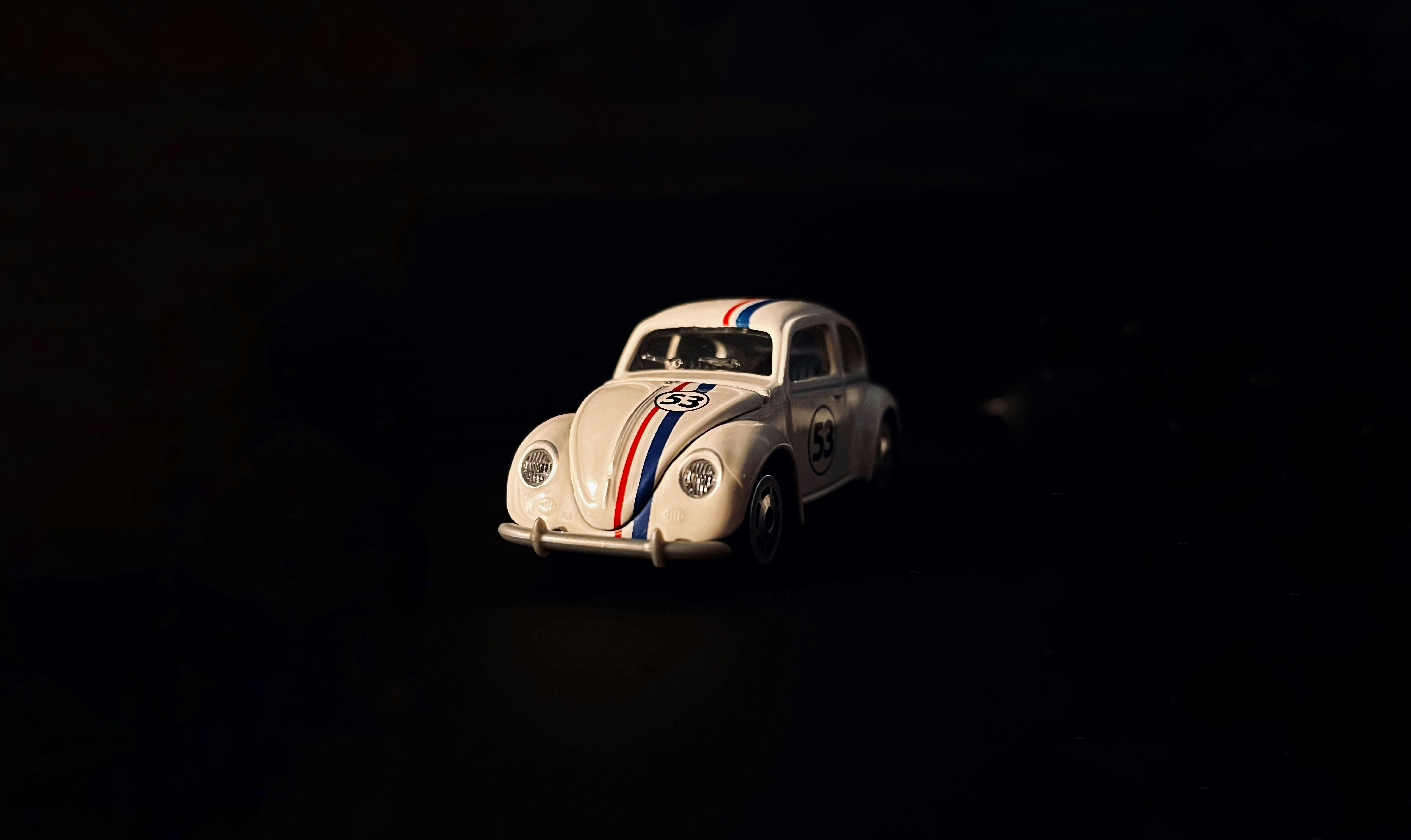 a white car with red, white, and blue stripes