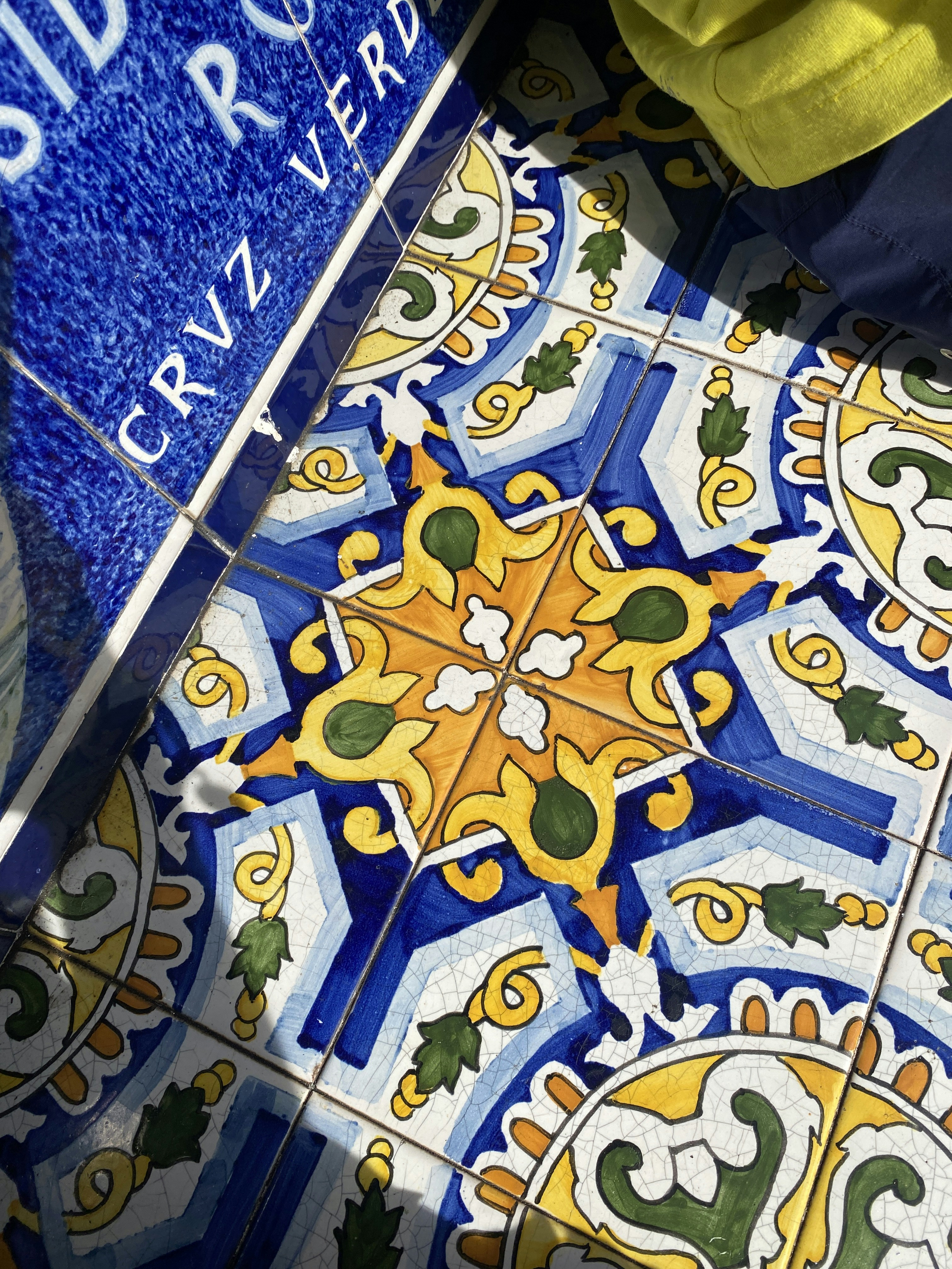 A close up of a tile floor with a name on it photo – Free Tile Image on ...