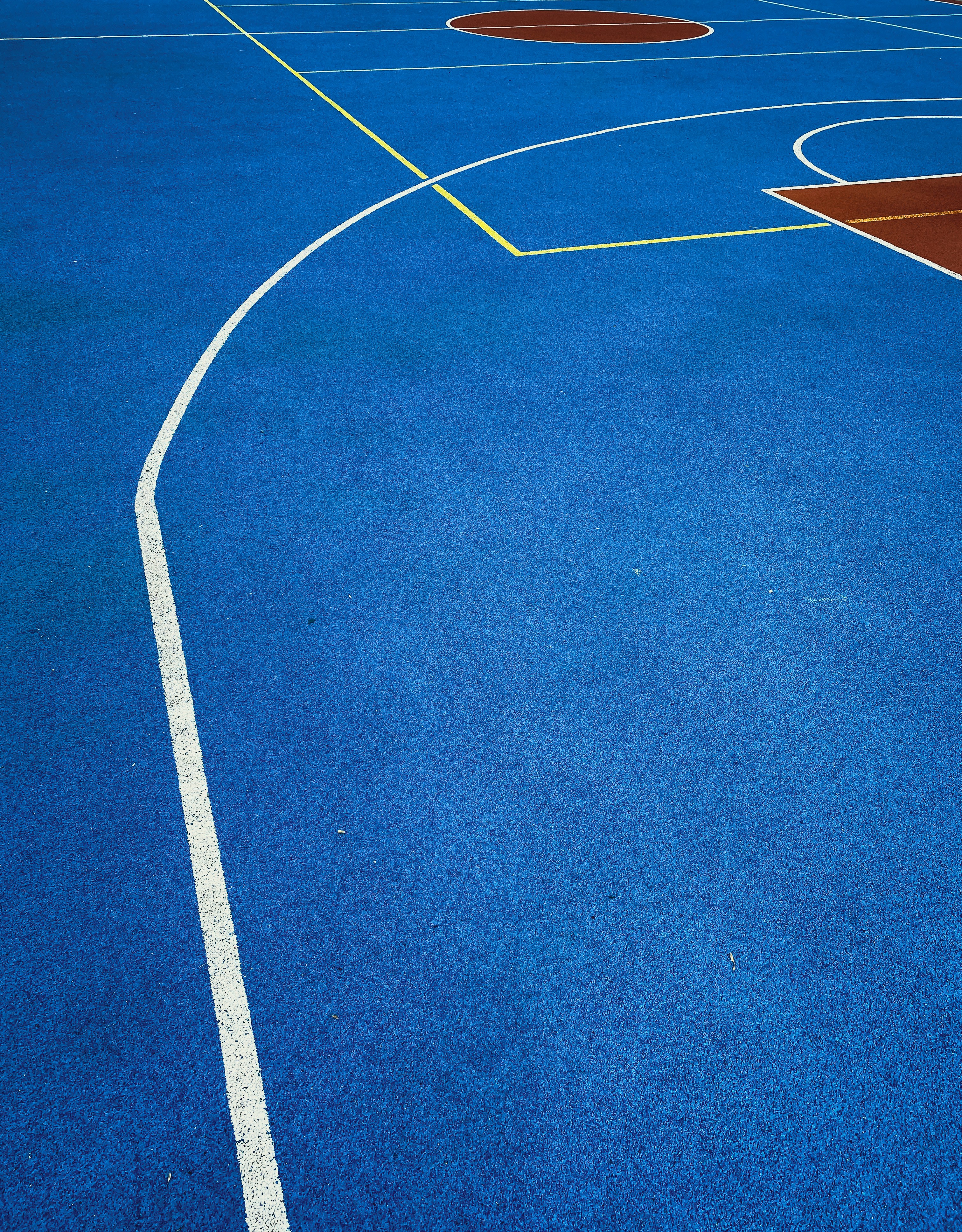 A blue basketball court with white lines on it photo – Free Brovary ...