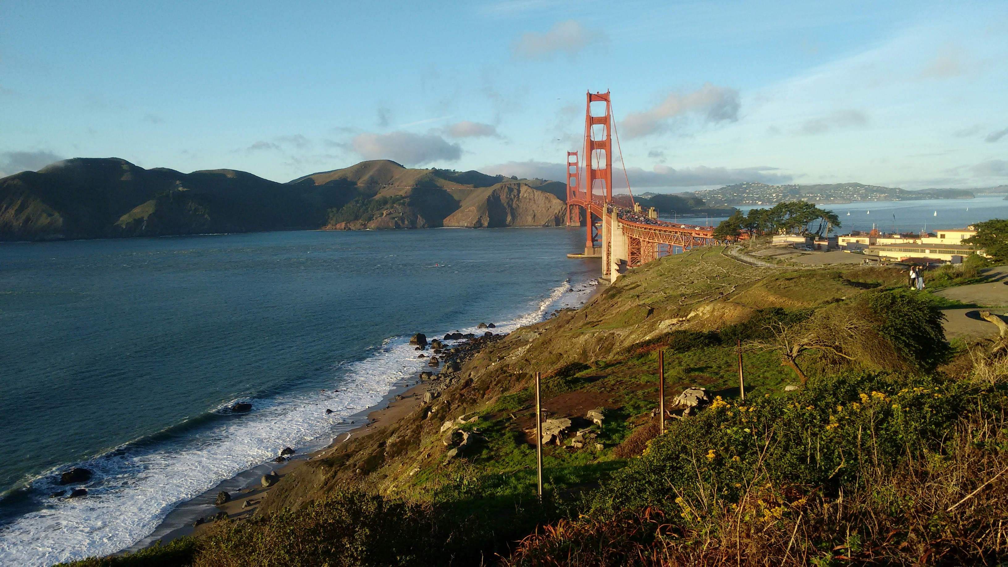A view of the golden gate bridge from the side of a hill photo – Free ...