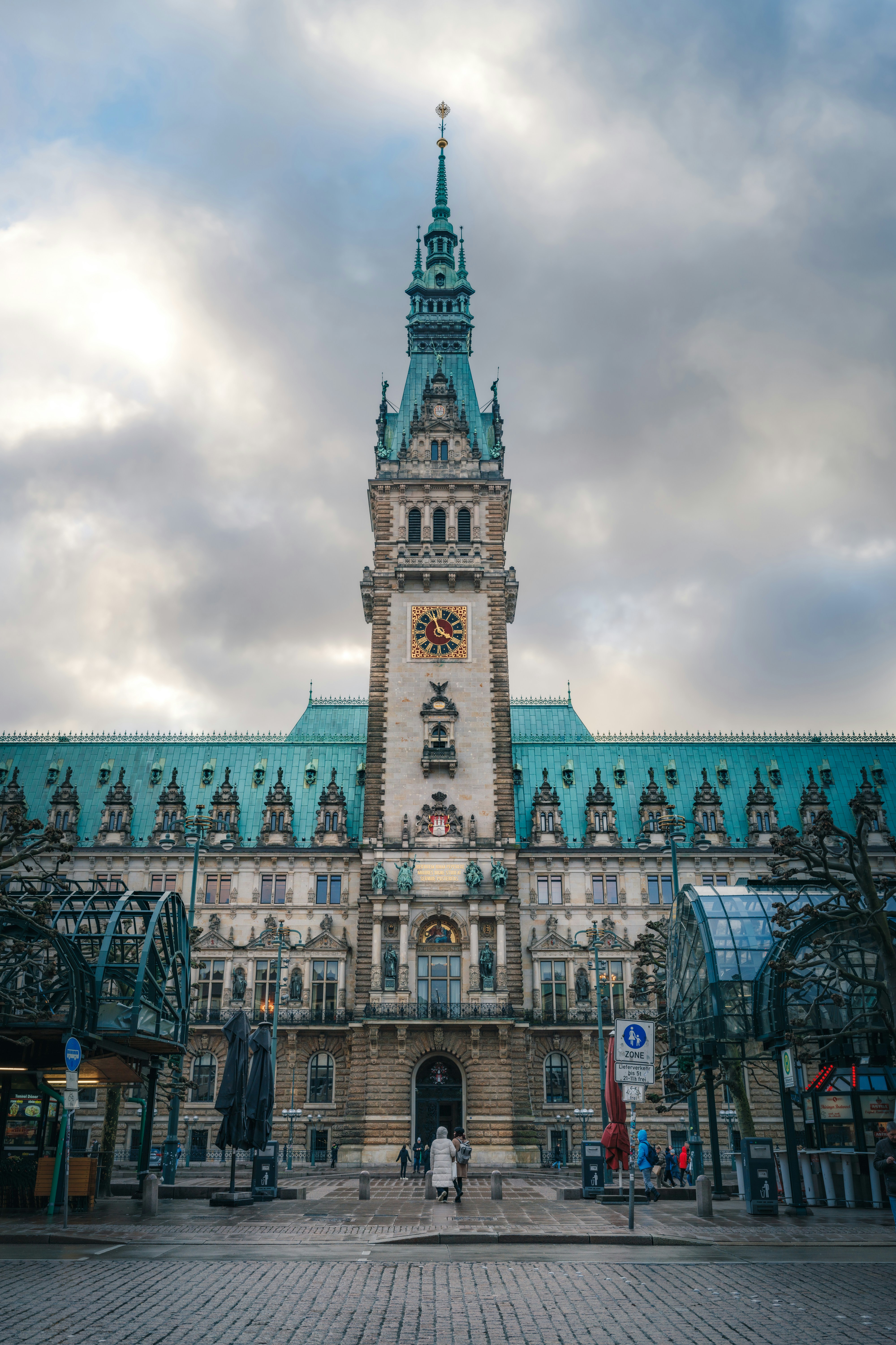 A large building with a clock on the front of it photo – Free Hamburg ...