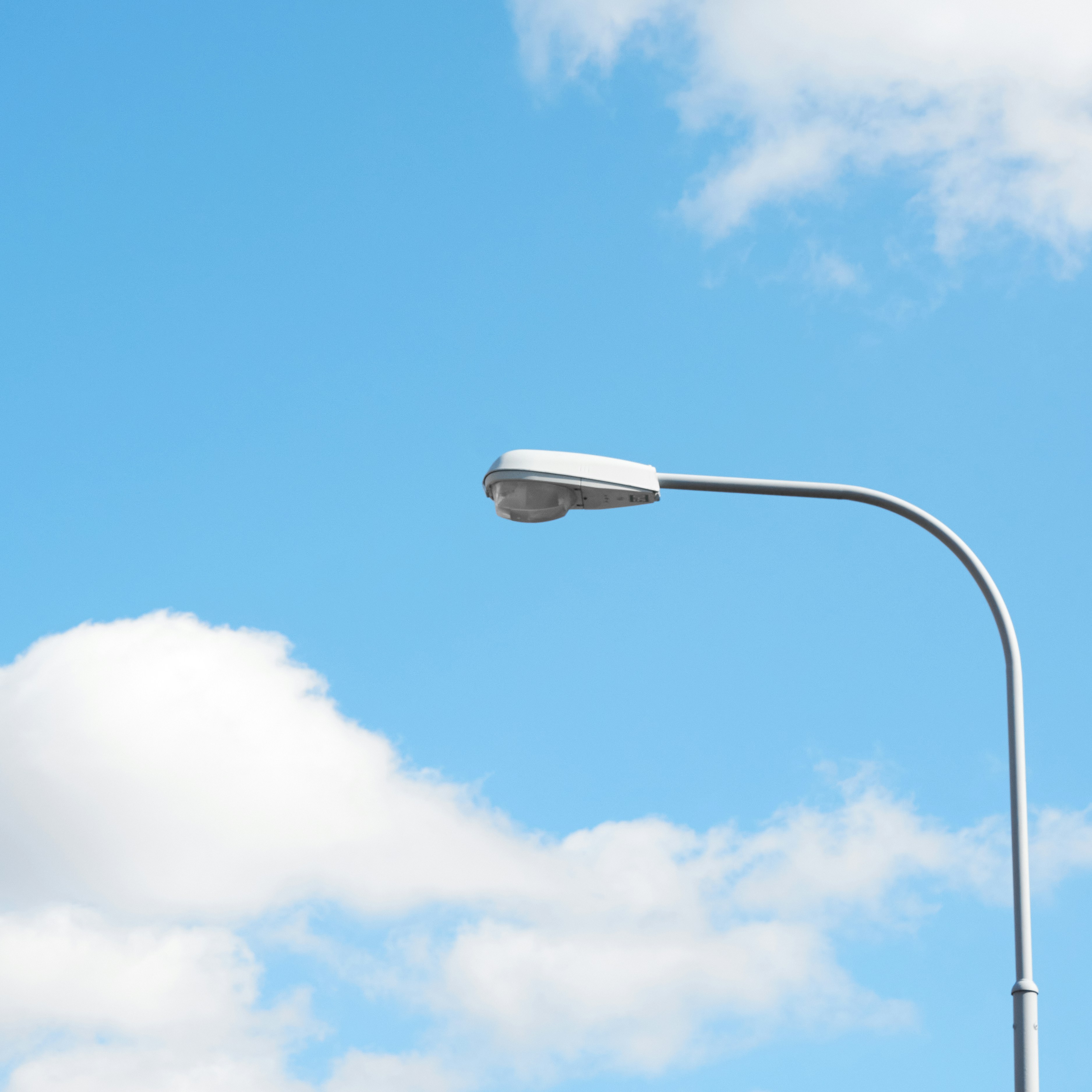 A street light with a blue sky in the background photo – Free Sky ...