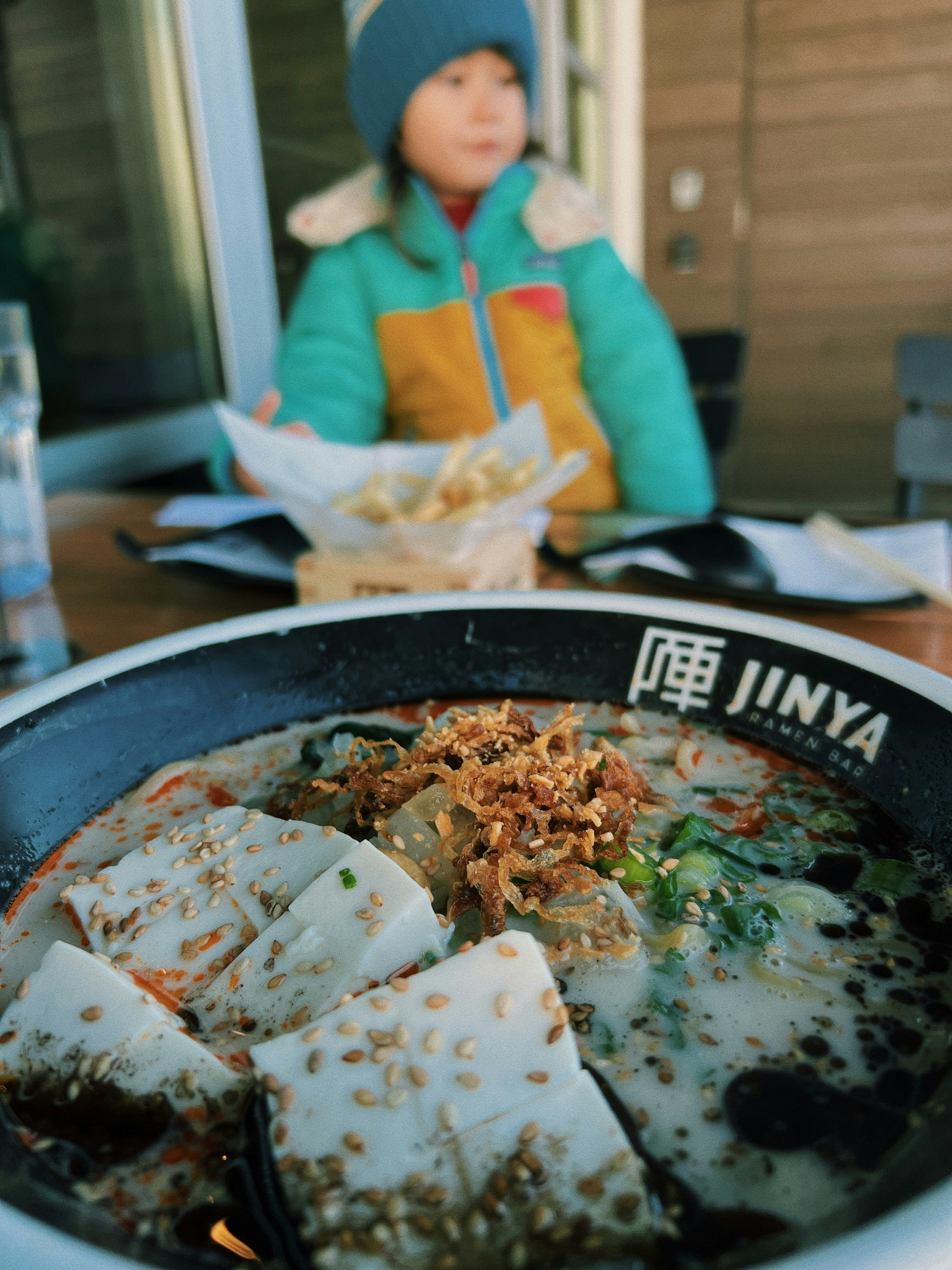 Crispy toppings and quiet curiosity at a ramen bowl moment