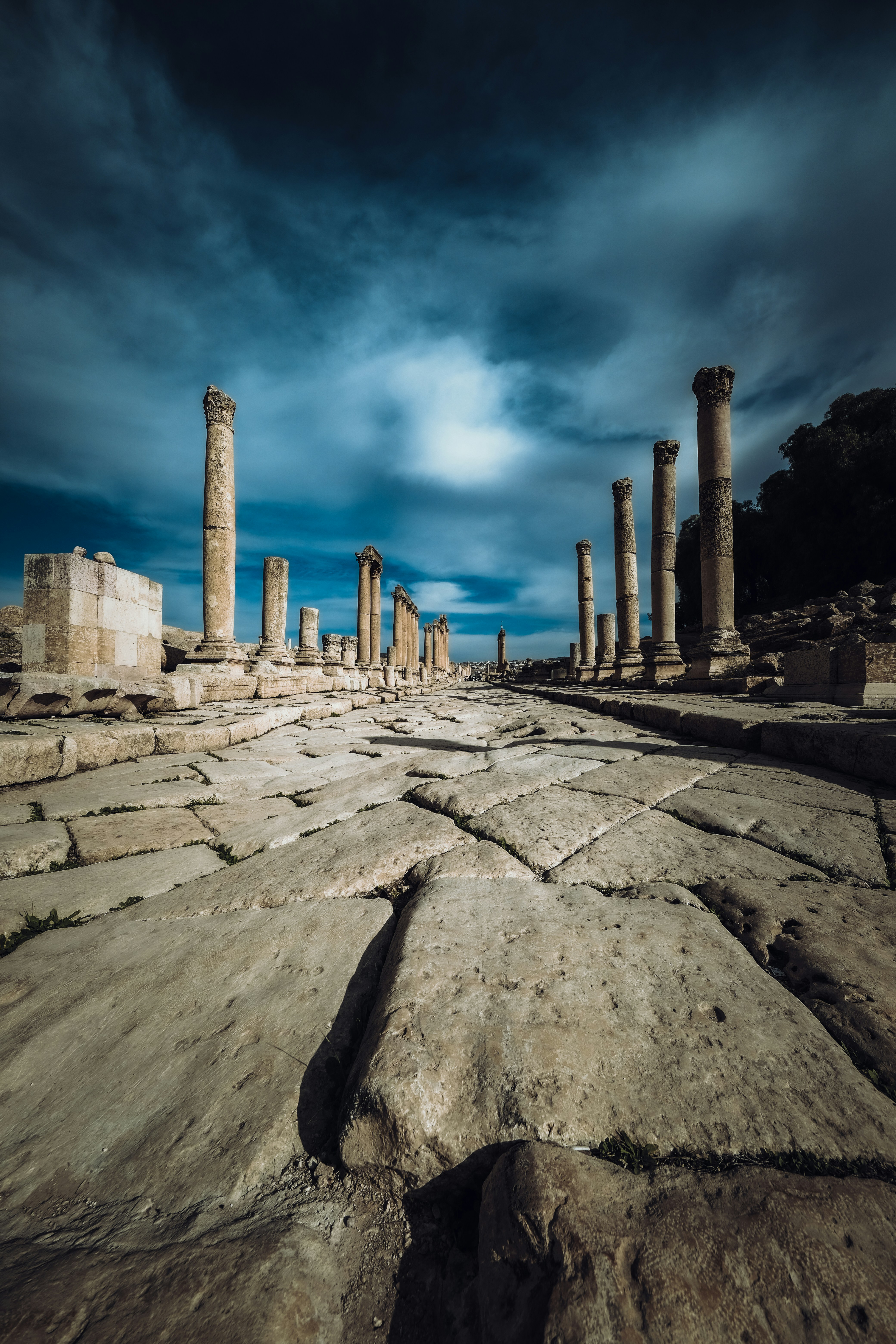 The ruins of a roman city under a cloudy sky photo – Free Ruins Image ...