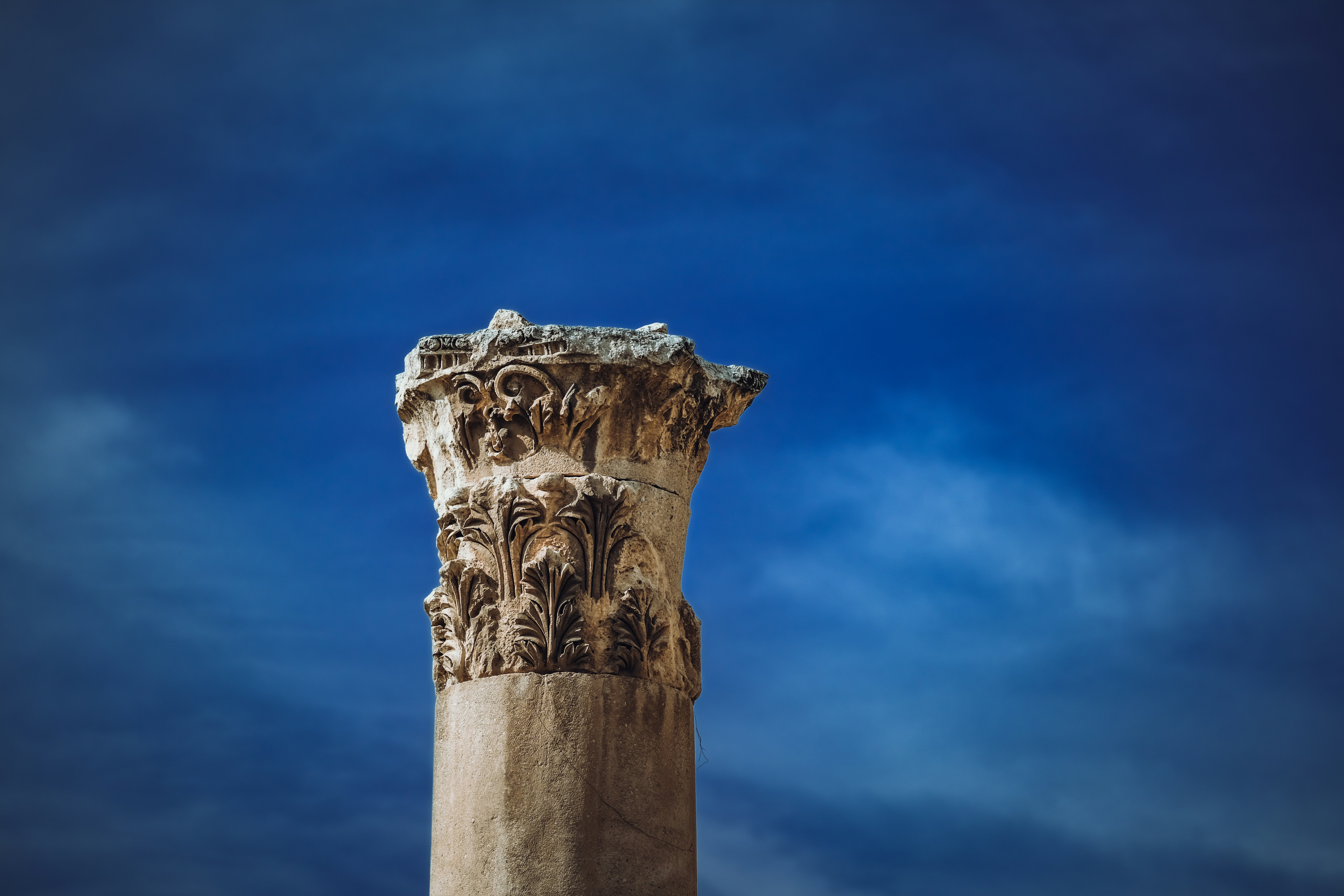 A tall pillar with a sky in the background photo – Free Pillar Image on ...