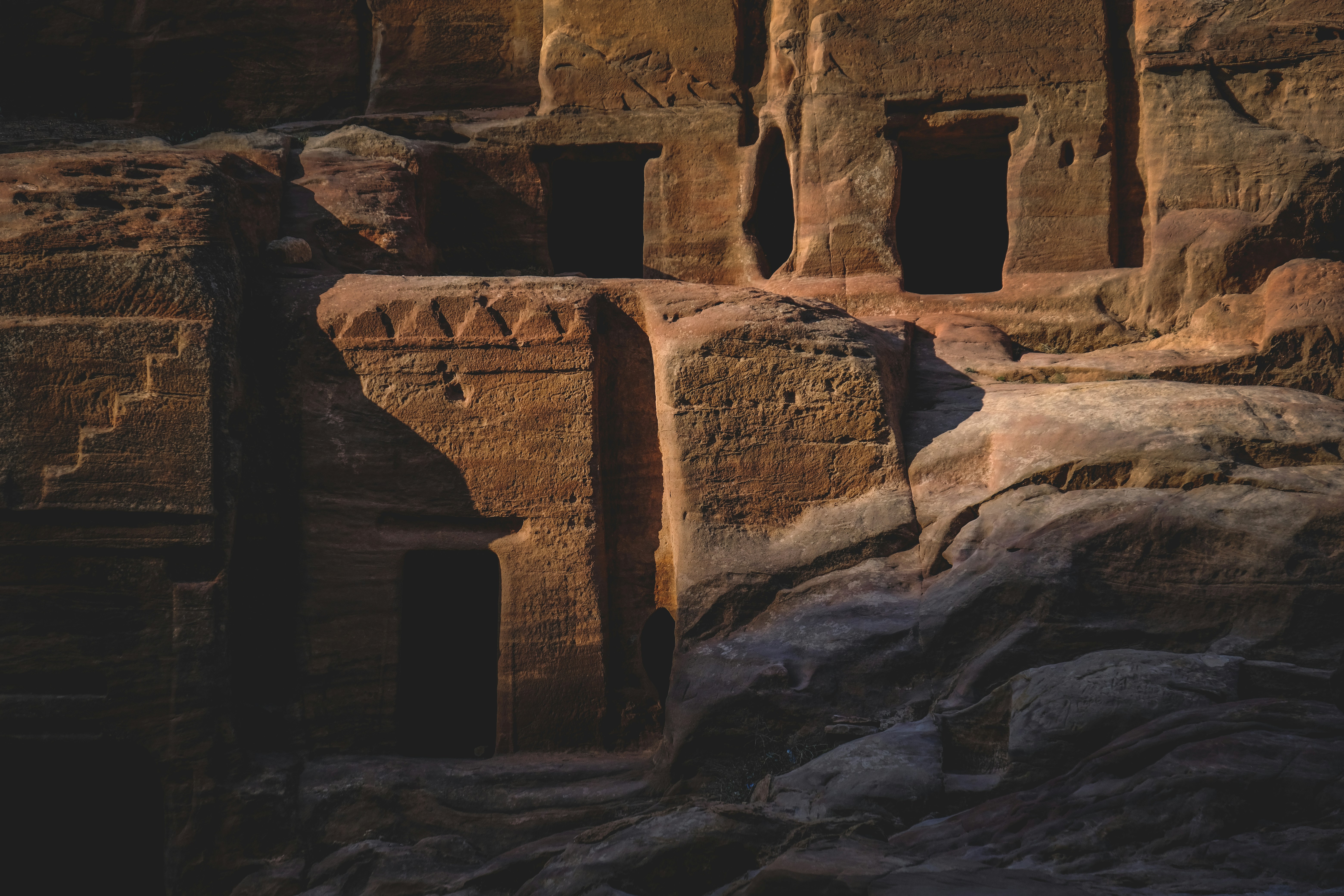A group of rock cut out buildings in a desert photo – Free Landmark ...