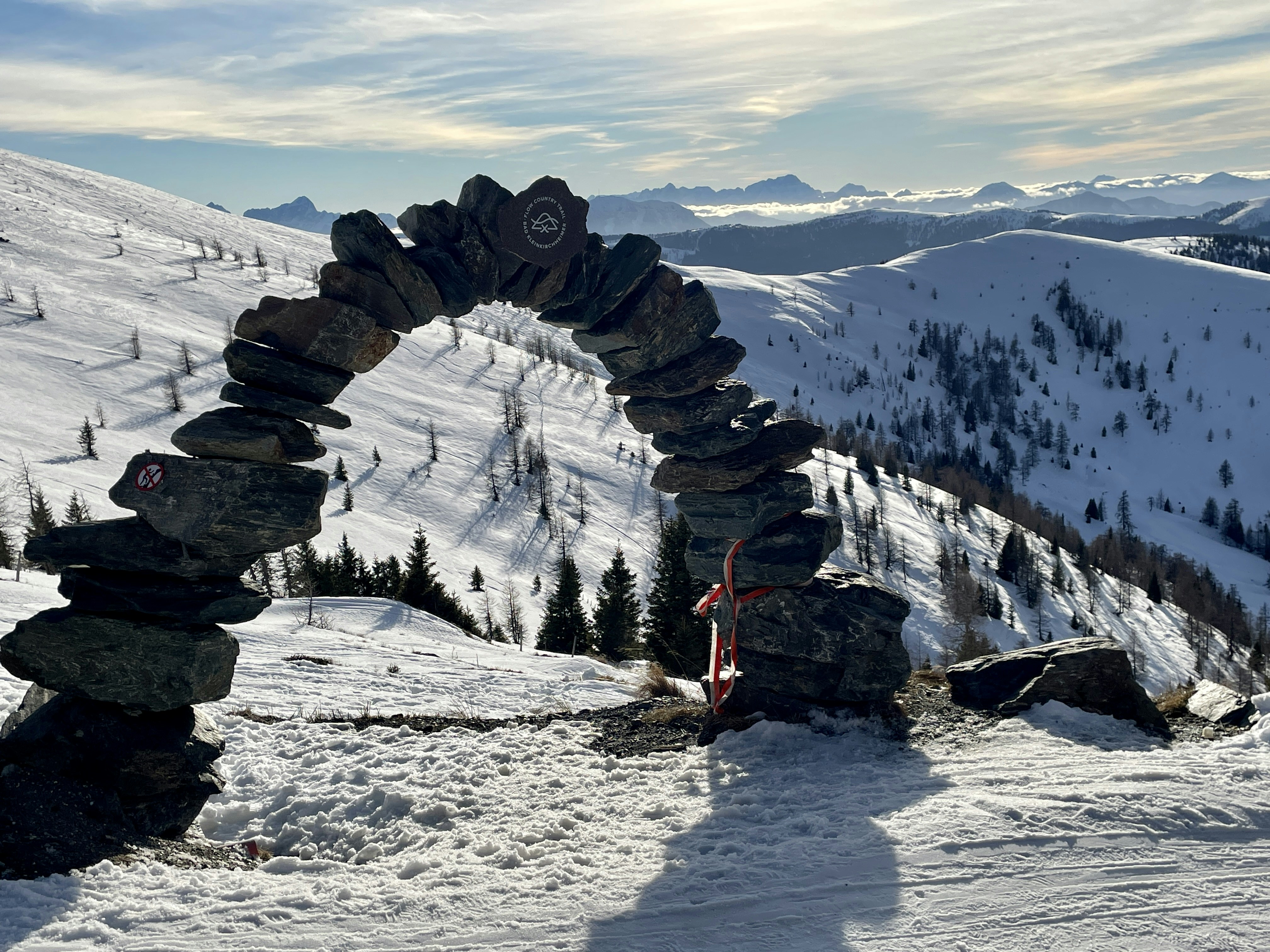 A large arch made out of rocks in the snow photo – Free Snow Image on ...