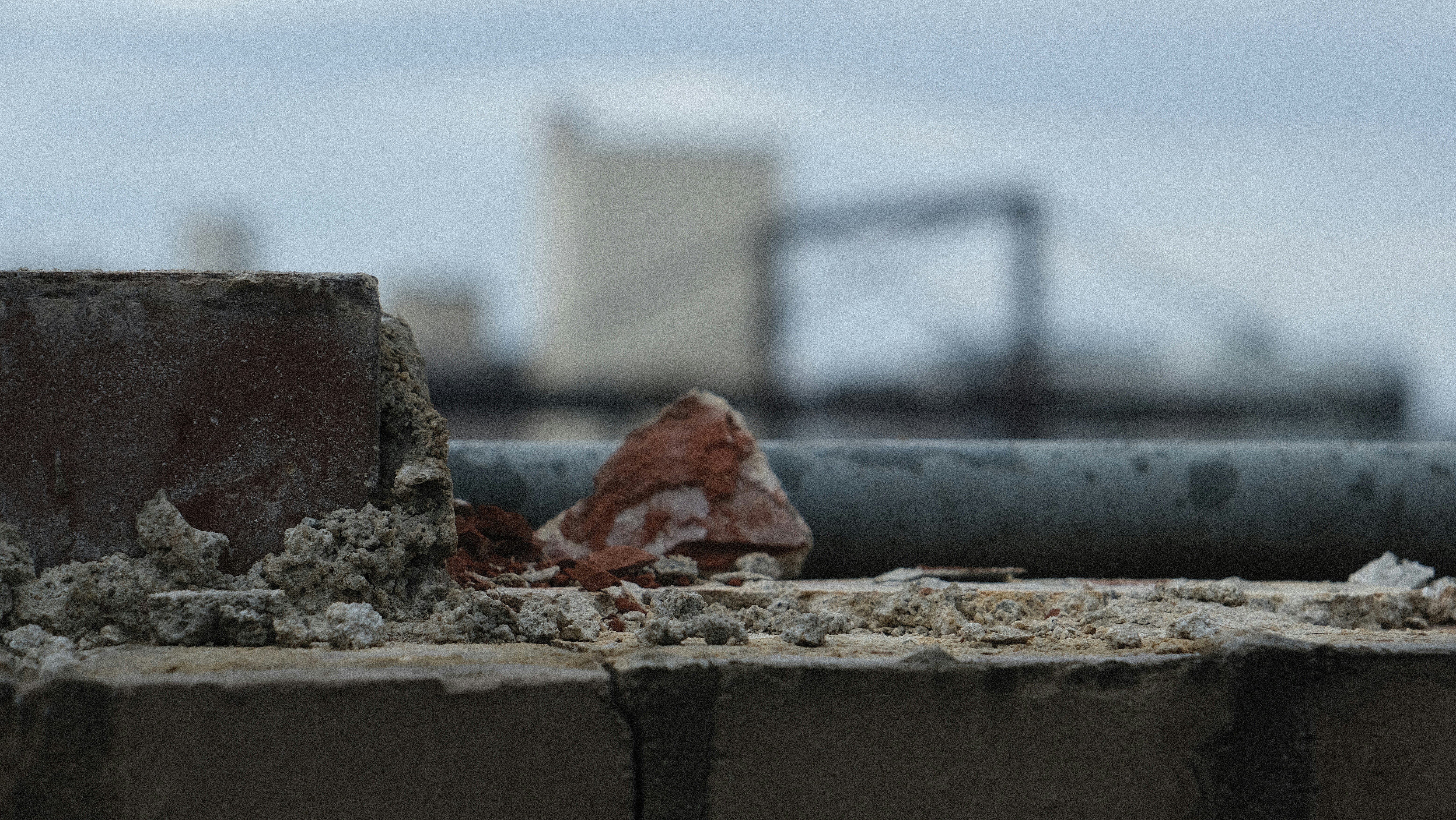 A piece of cement sitting on top of a cement block photo – Free ...
