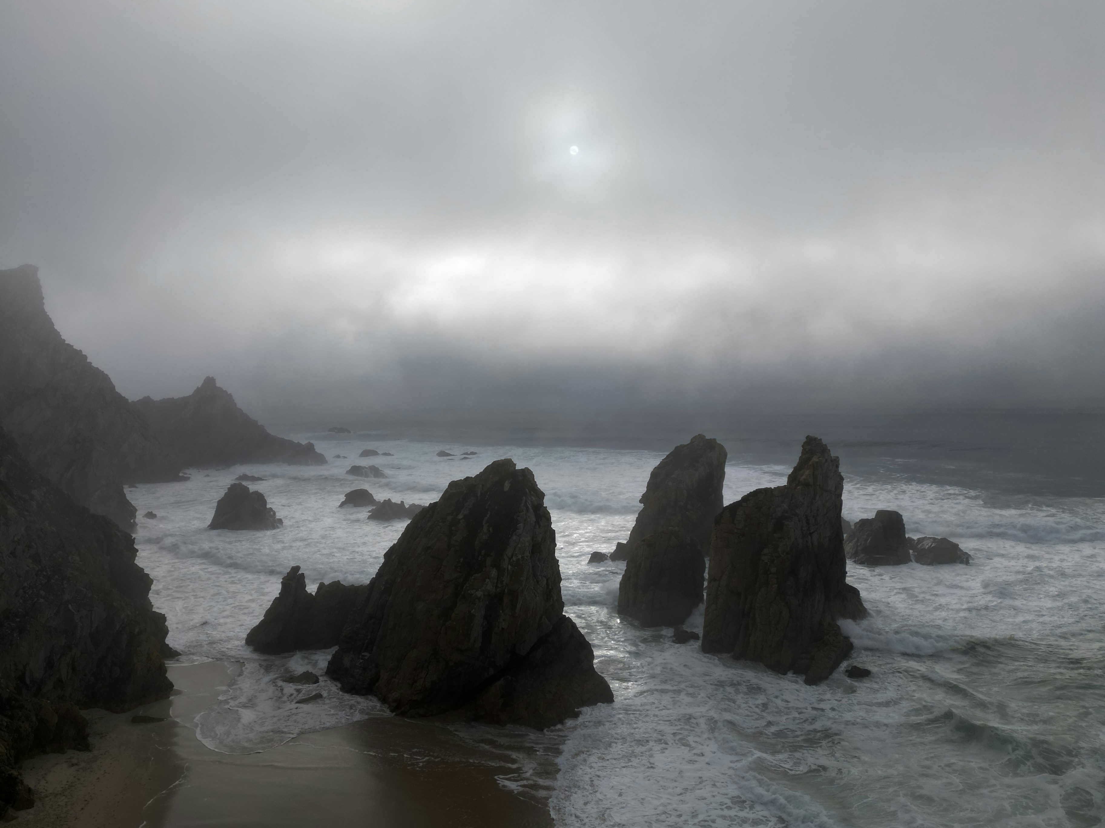 A view of the ocean with rocks in the foreground photo – Free Rock ...