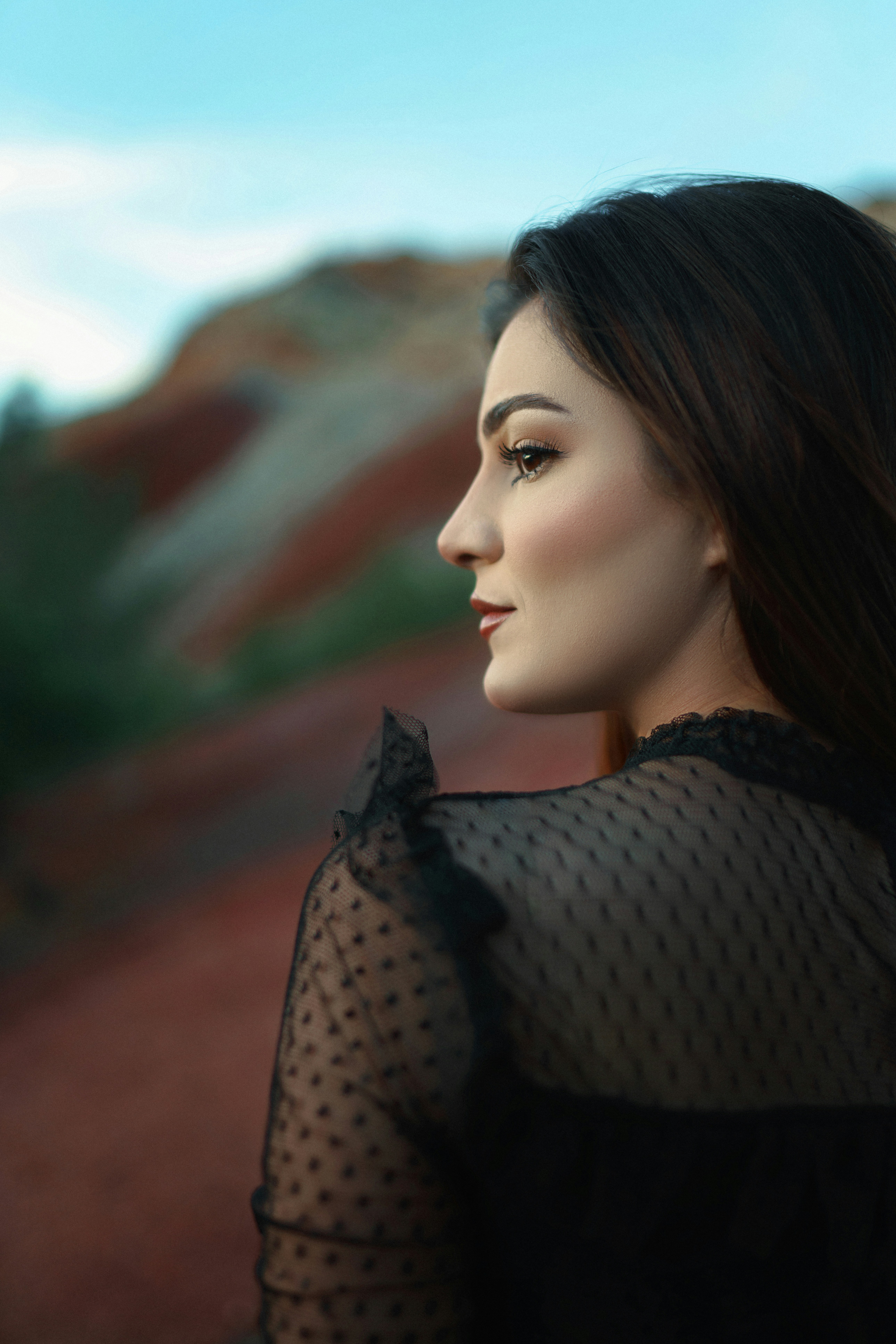 Profile in Soft Focus: Girl Against Deserted Landscape