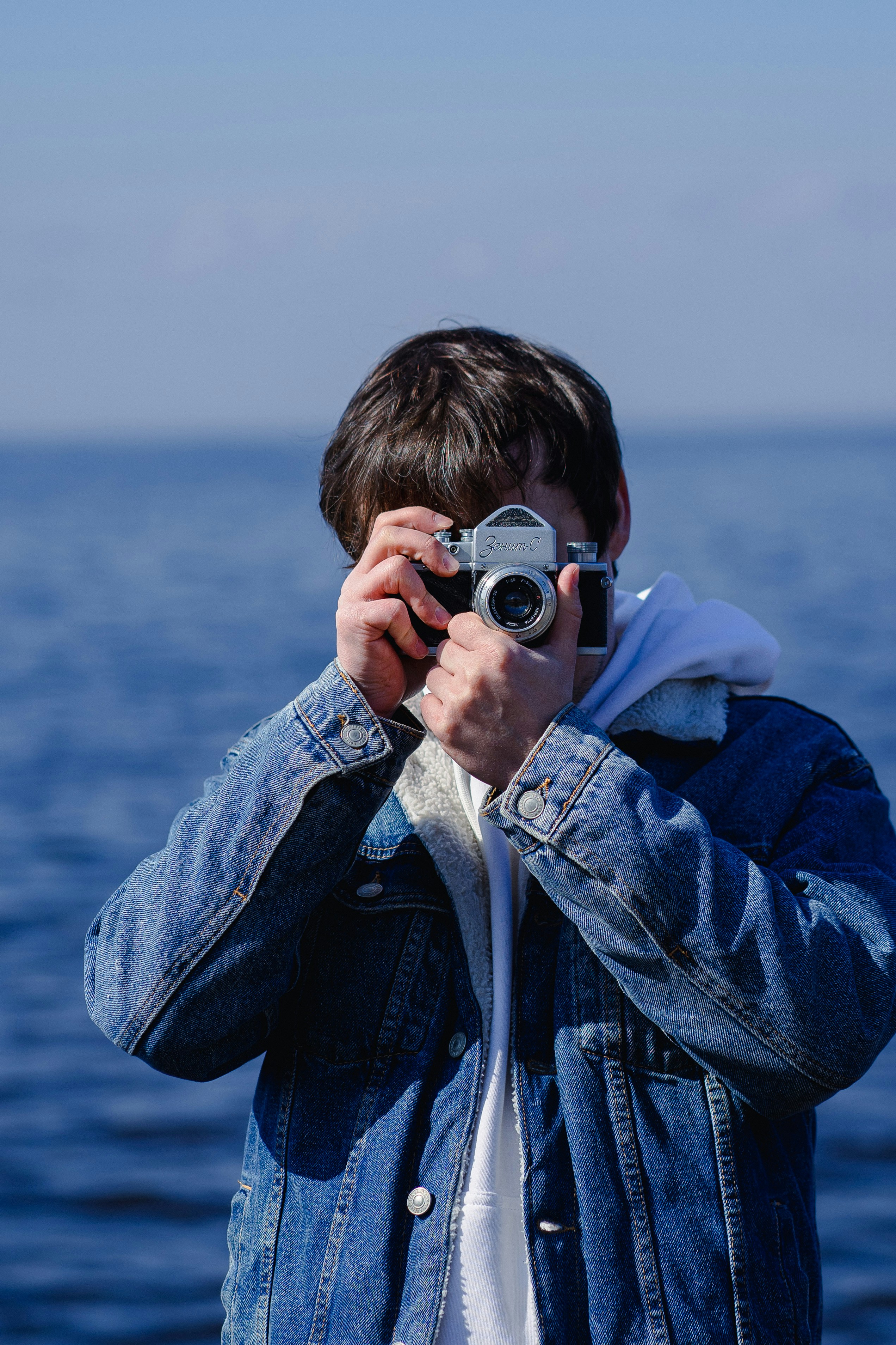 Denim at the Edge: A Silver-Lens Seaside Portrait