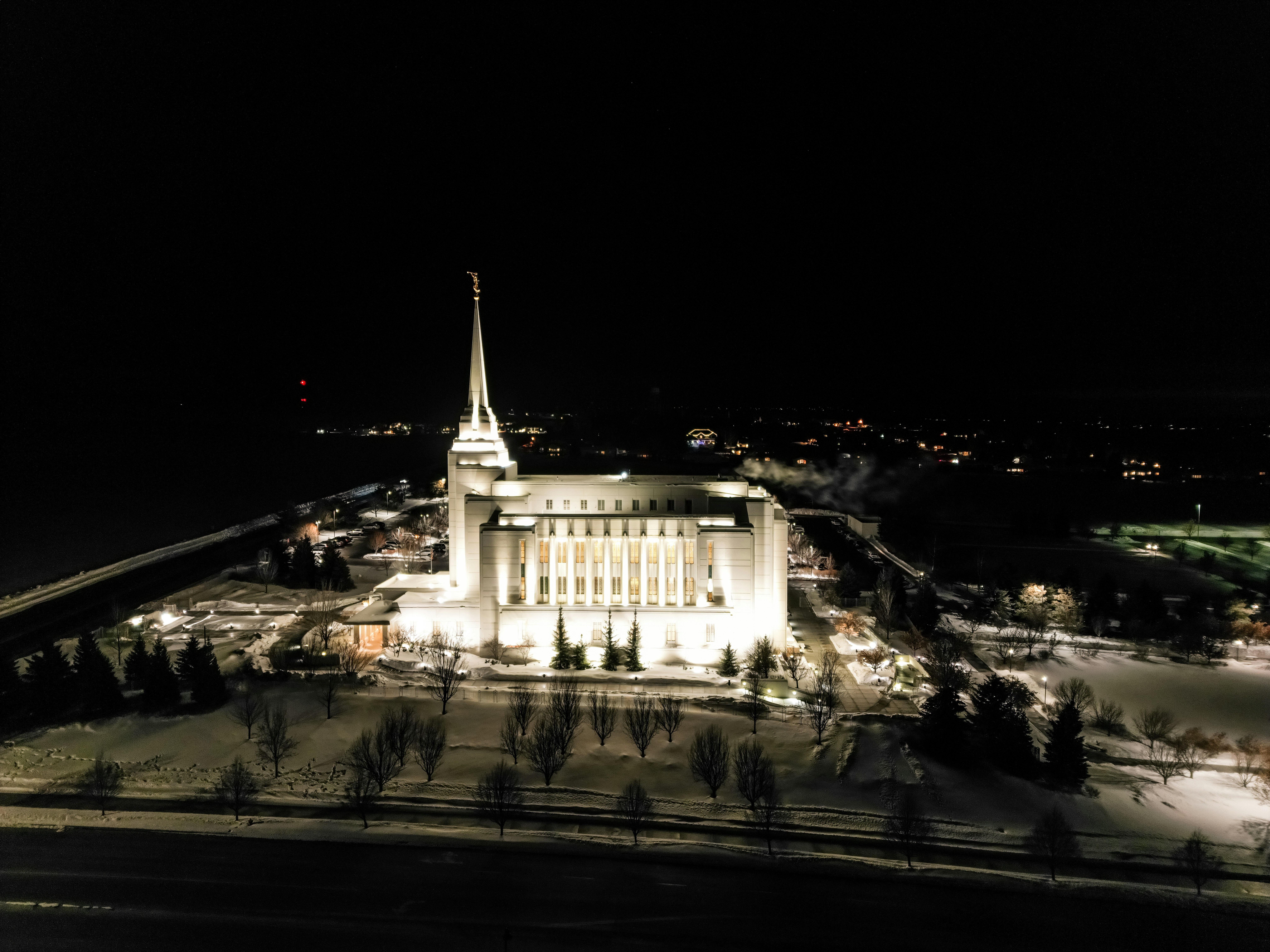 An aerial view of a building lit up at night photo – Free Rexburg ...