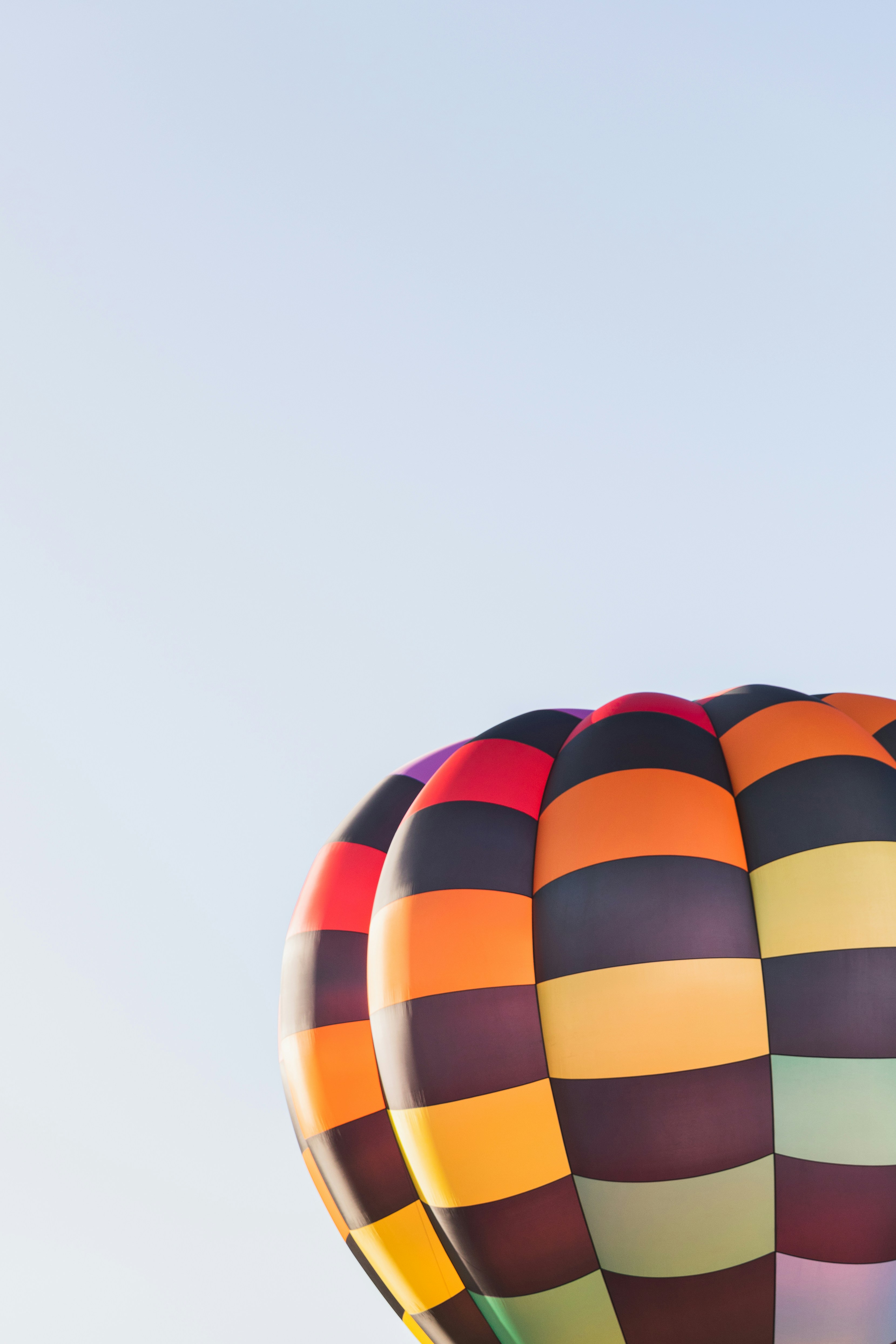 Colorful ascent: a hot-air balloon canopy peeking into the frame