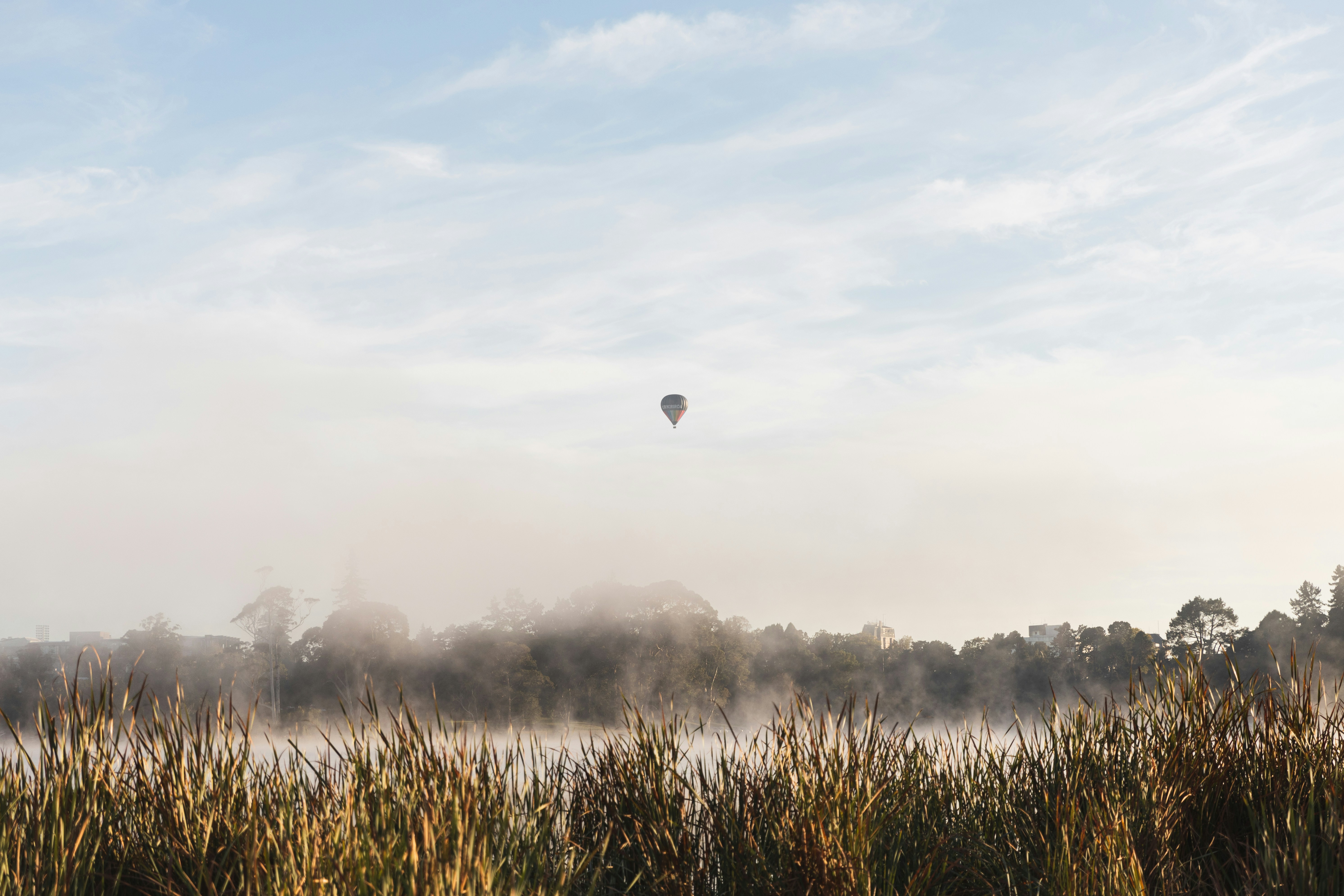 Morning Ascent Above the Misty Lake