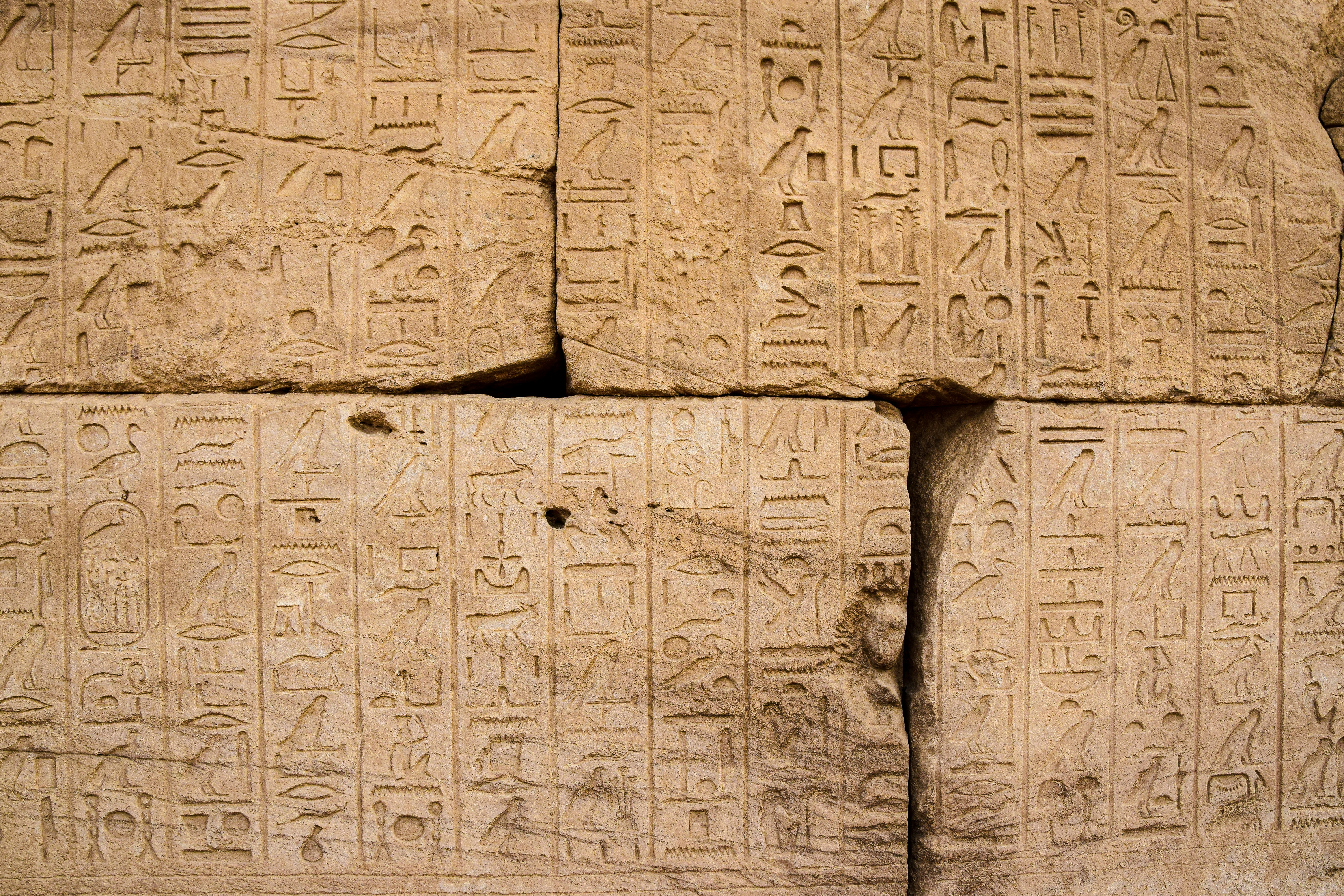 A close up of a stone wall with writing on it photo – Free Luxor Image ...