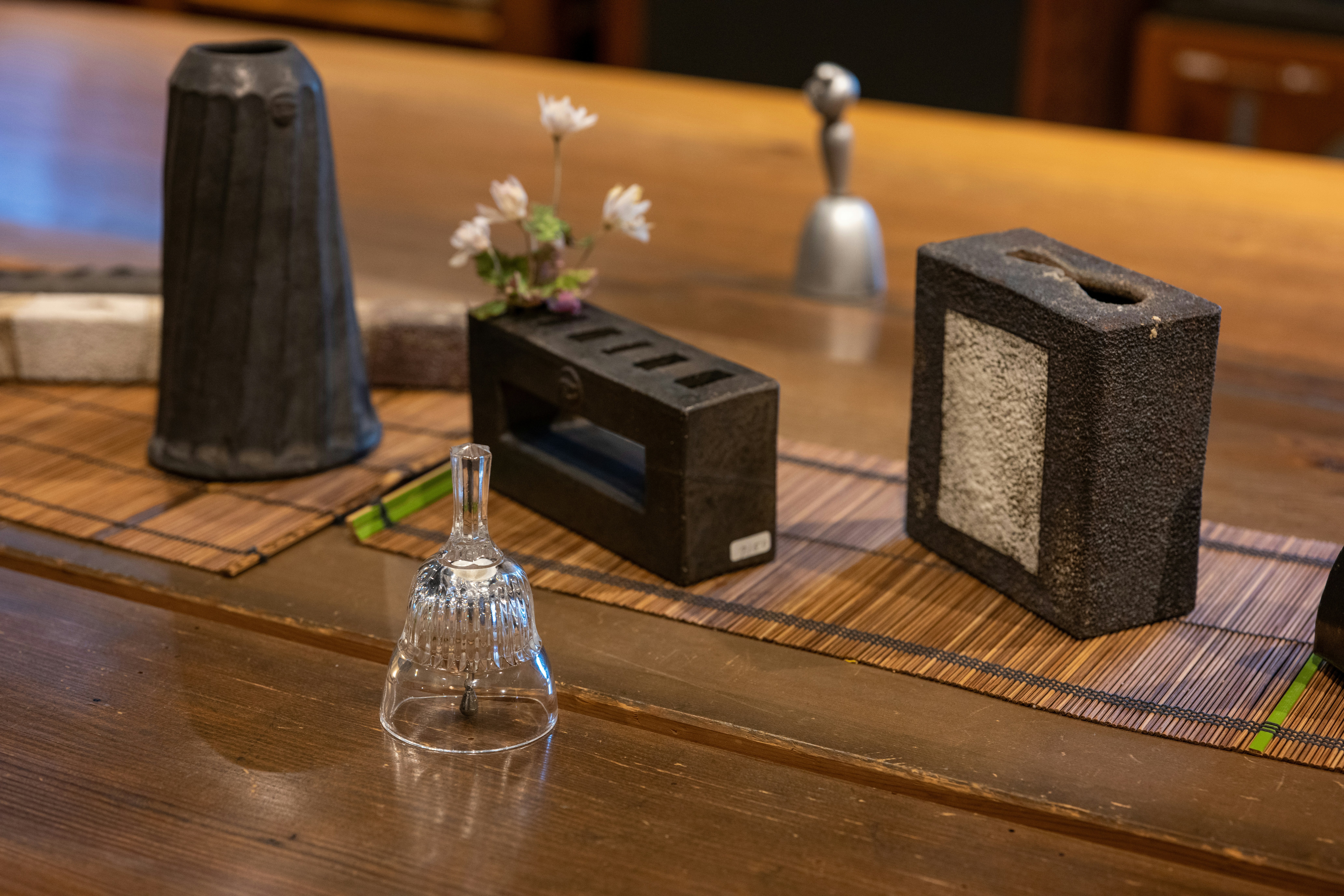 Quiet Mise-en-Scene: Glass Bell and Barware Bathed in Warm Bar Light