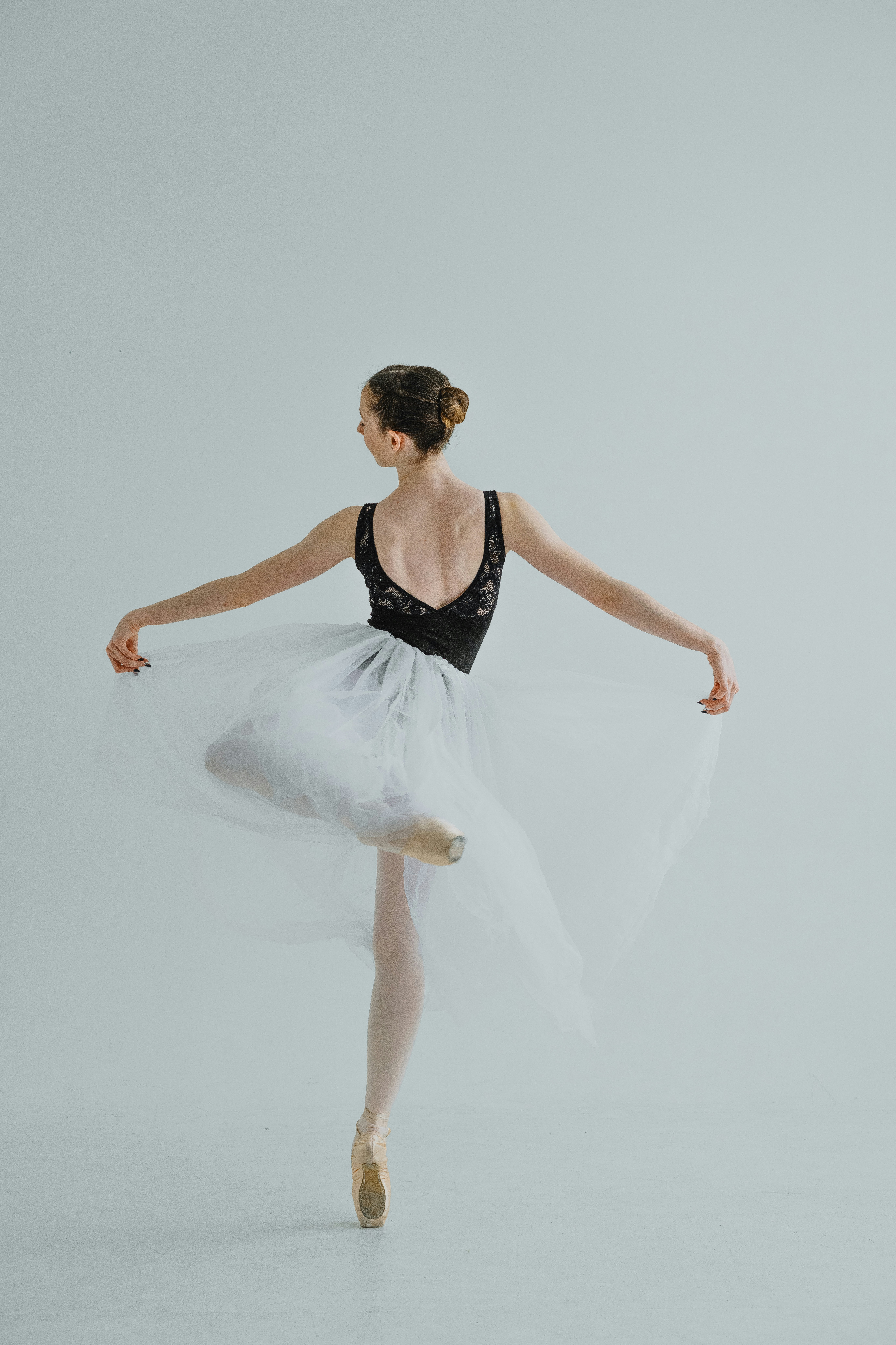 A ballerina in a black leotard and white tulle photo – Free Dancing ...
