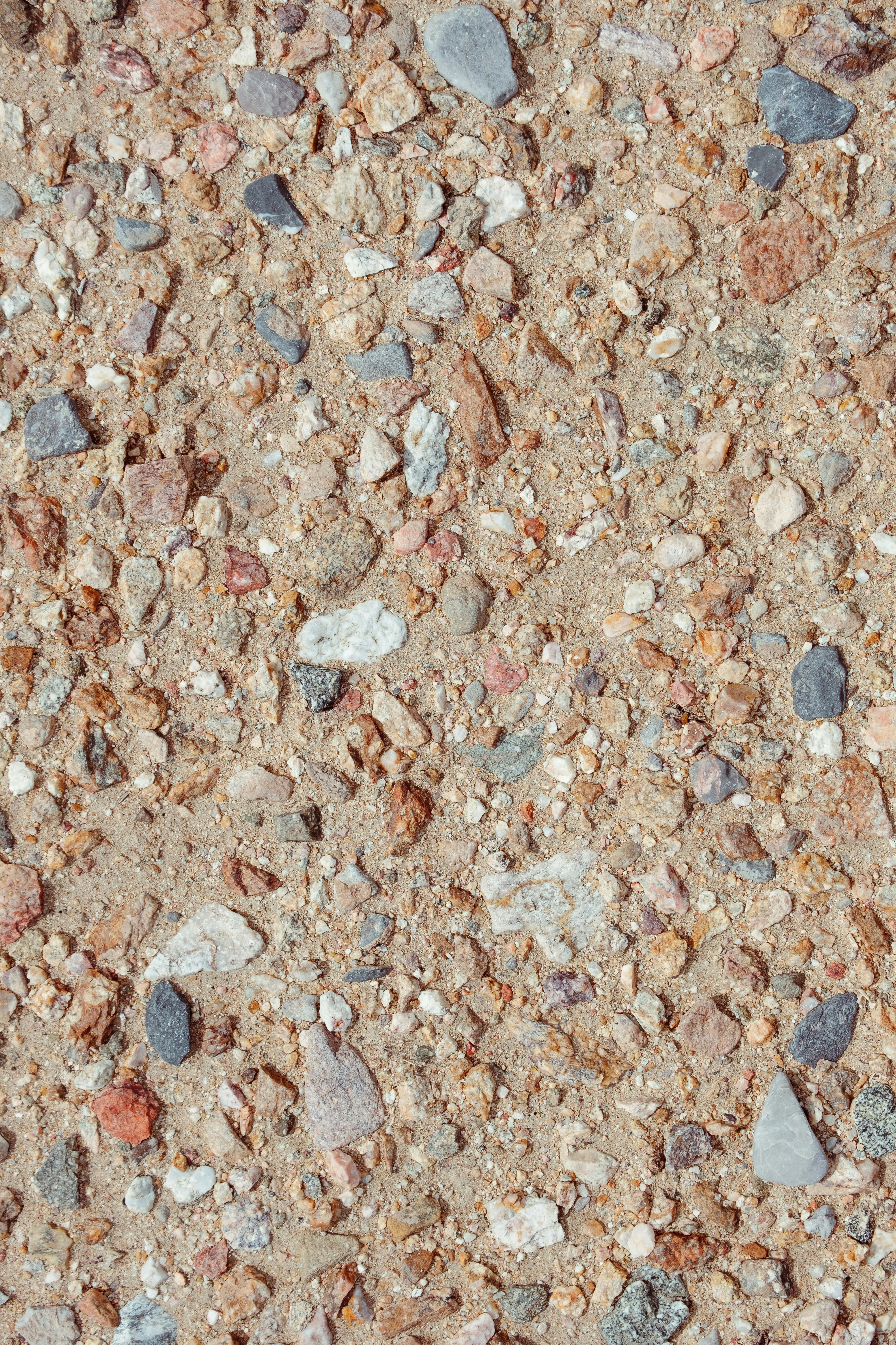 A close up of rocks and gravel on a surface photo – Free Rock Image on ...