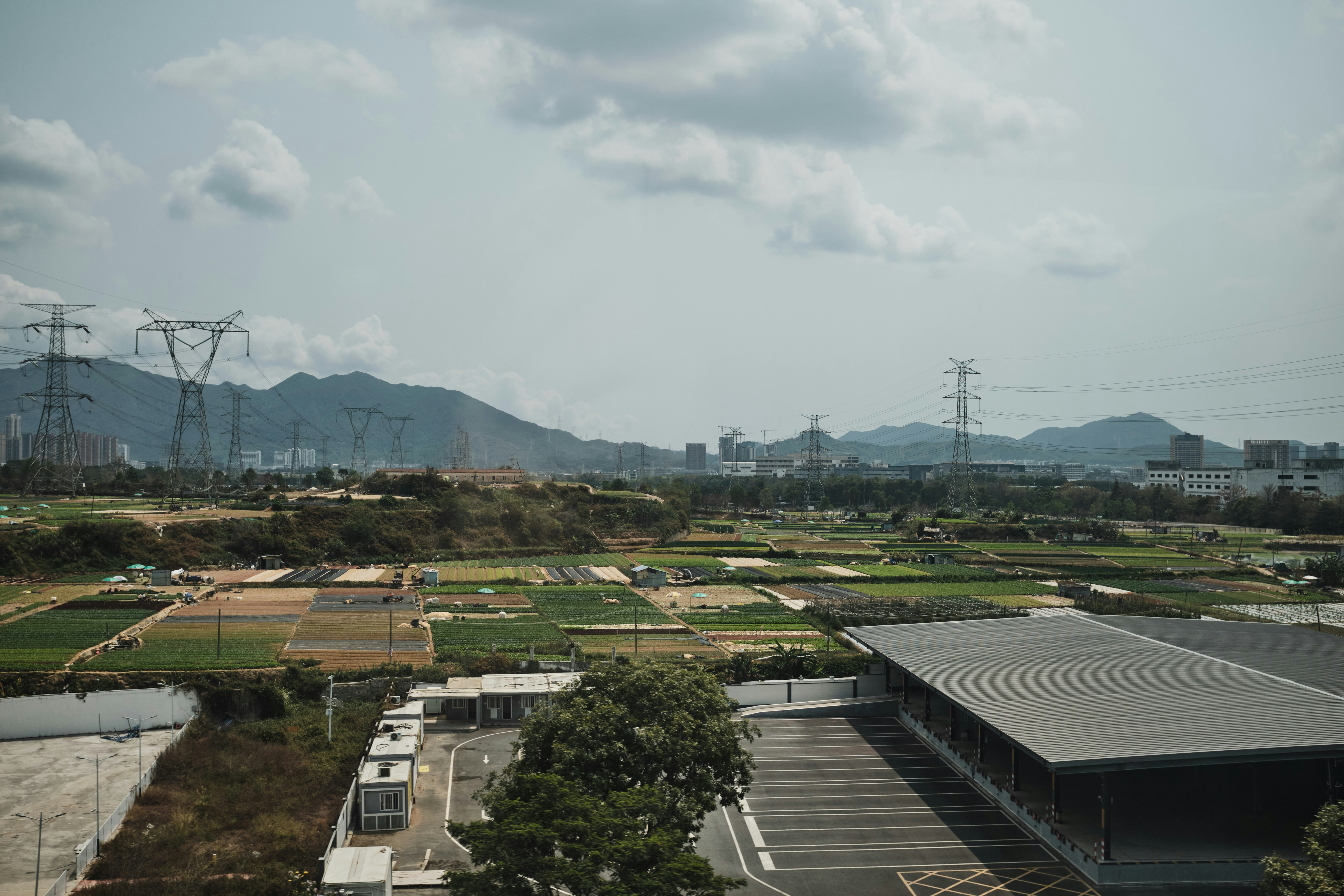 Rooftop Terrace Over a Patchwork Plain with Mountain Backdrop