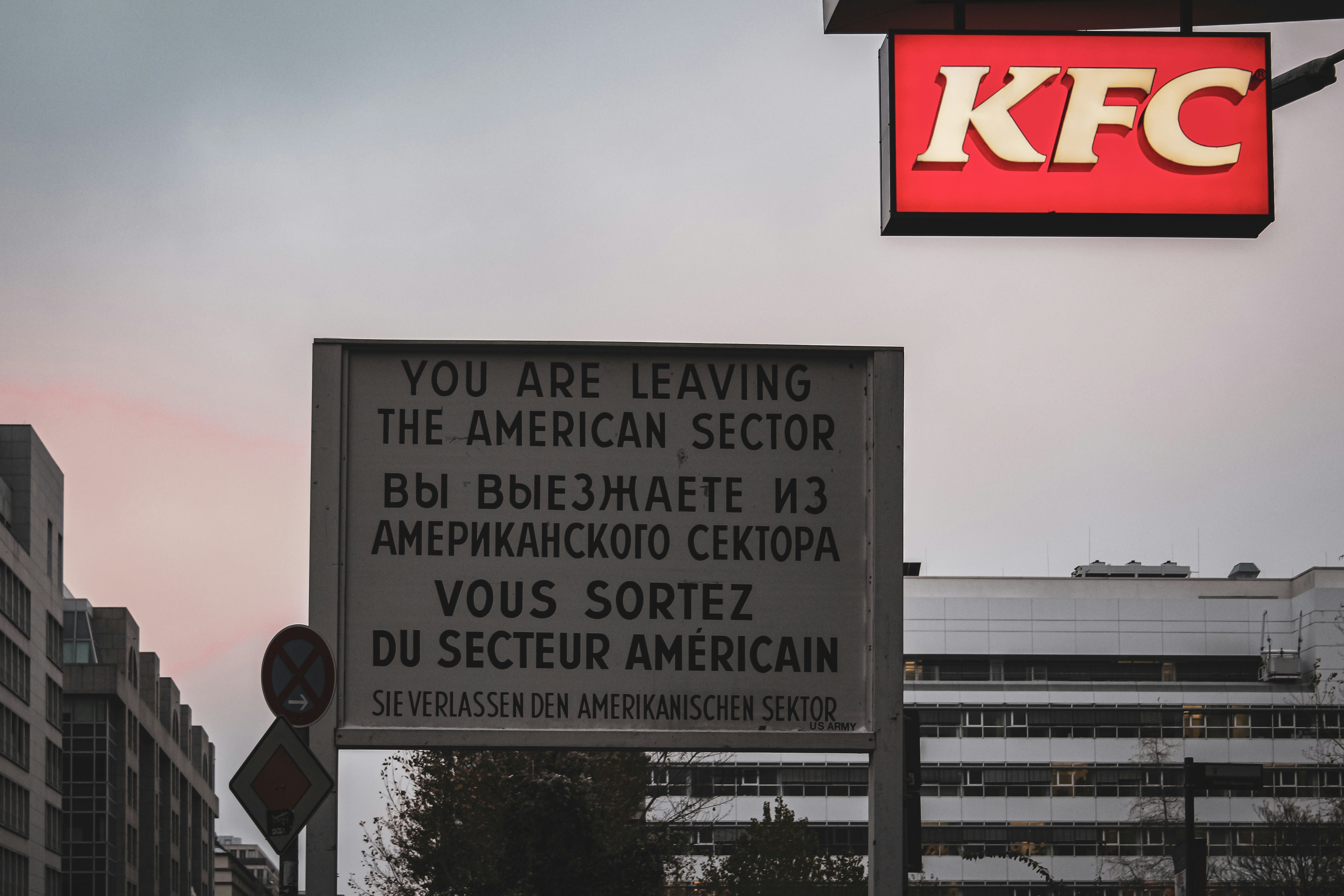 A kfc sign hanging off the side of a building photo – Free Berlin Image ...