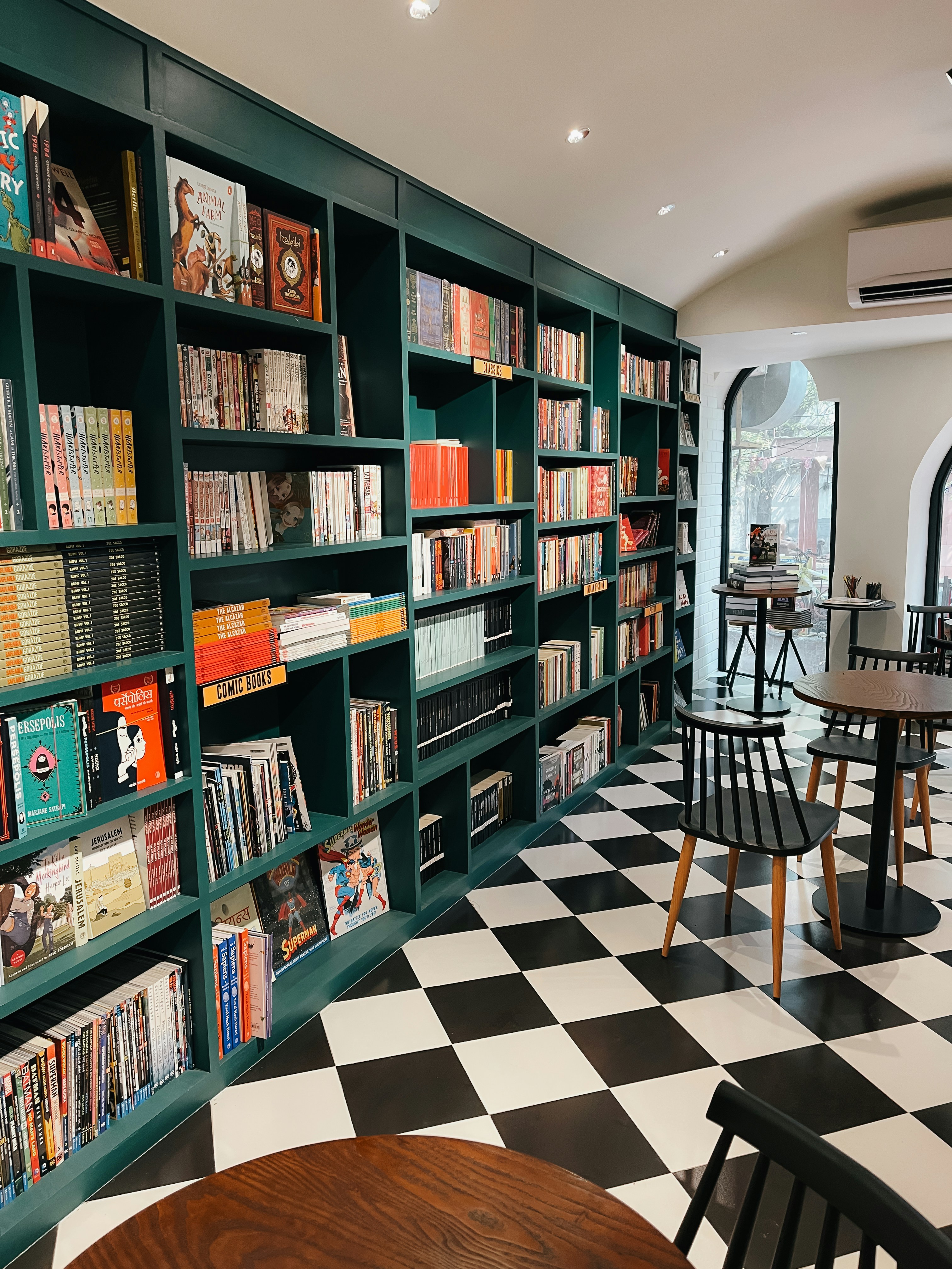 A room filled with lots of books and tables photo – Free Furniture ...