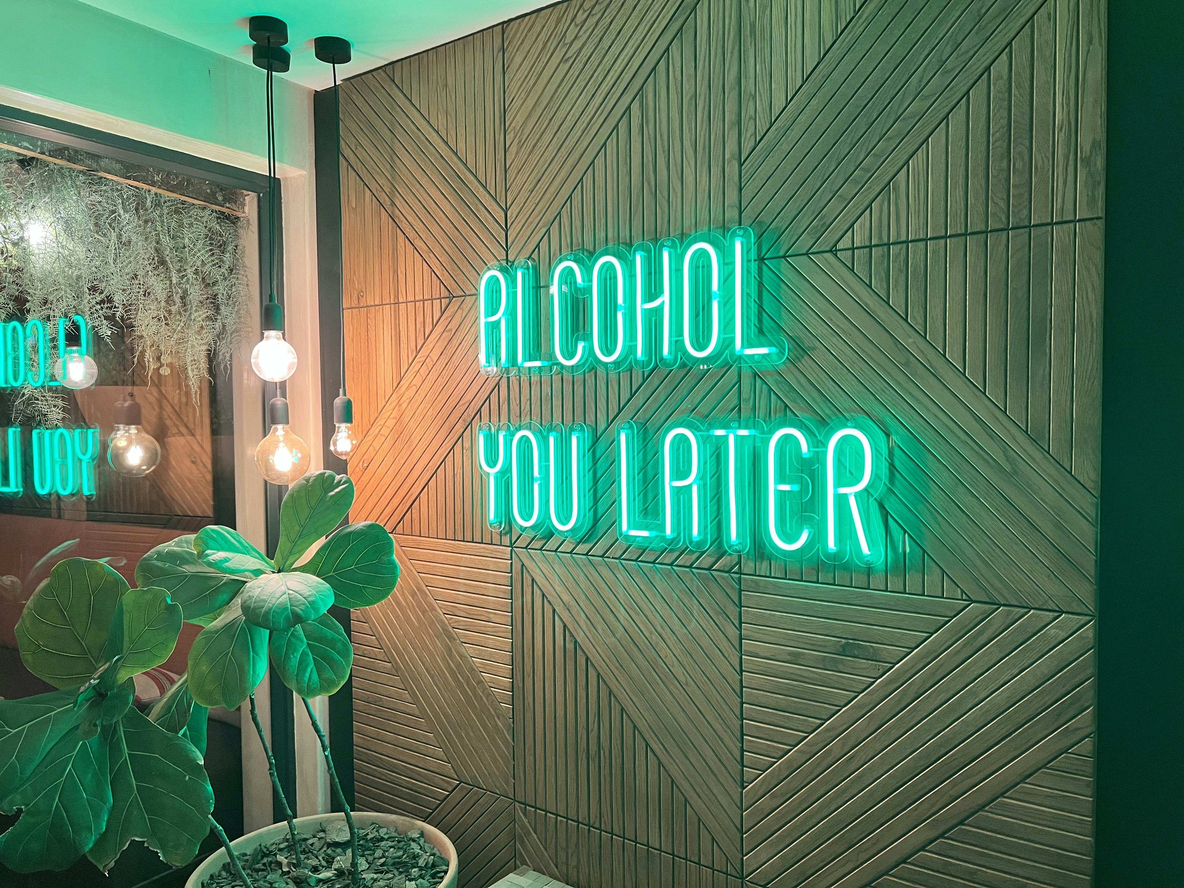 A green neon sign that reads alcohol you later photo – Free Interior ...