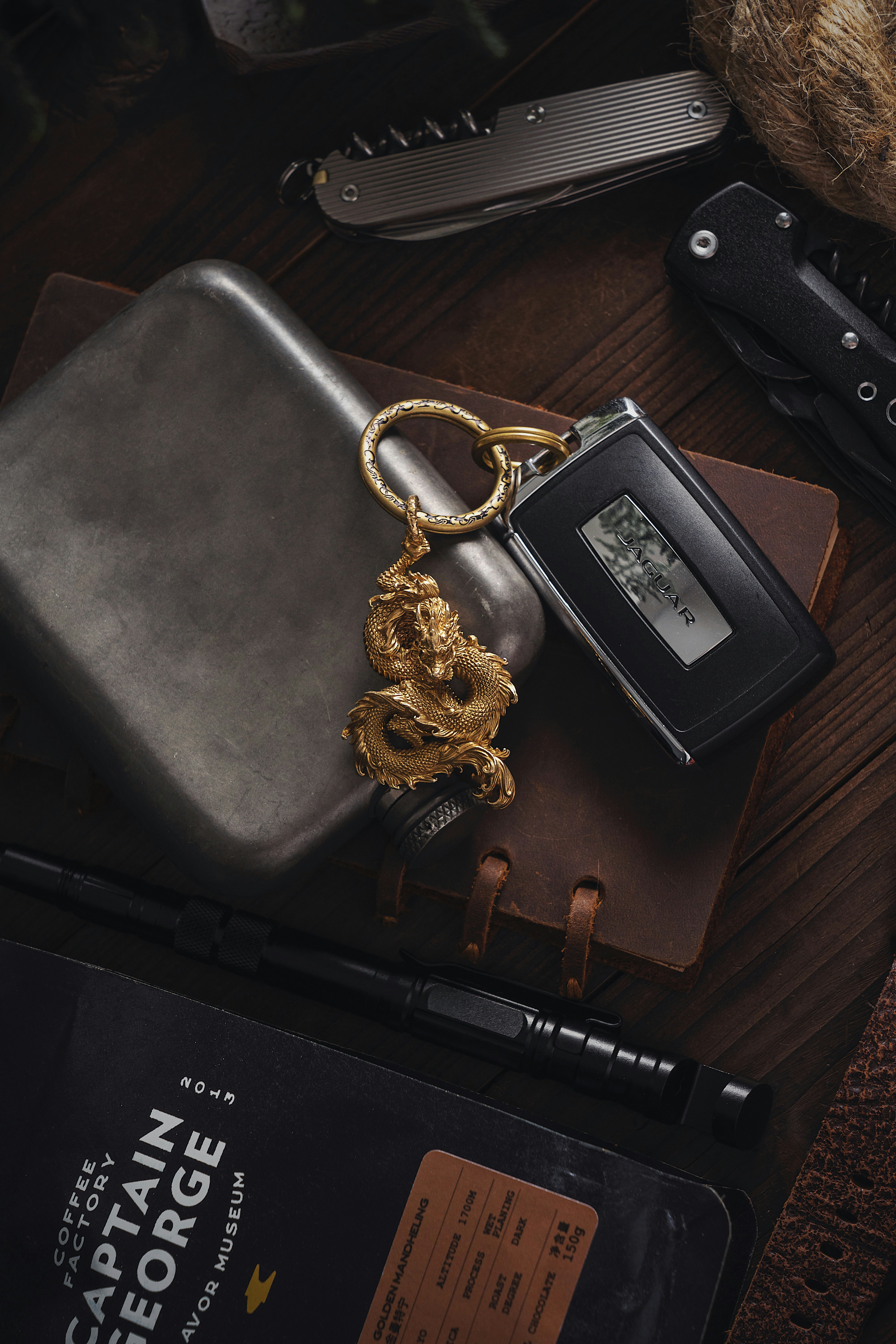 A wallet with a keychain and a watch on top of it photo – Free Baton ...