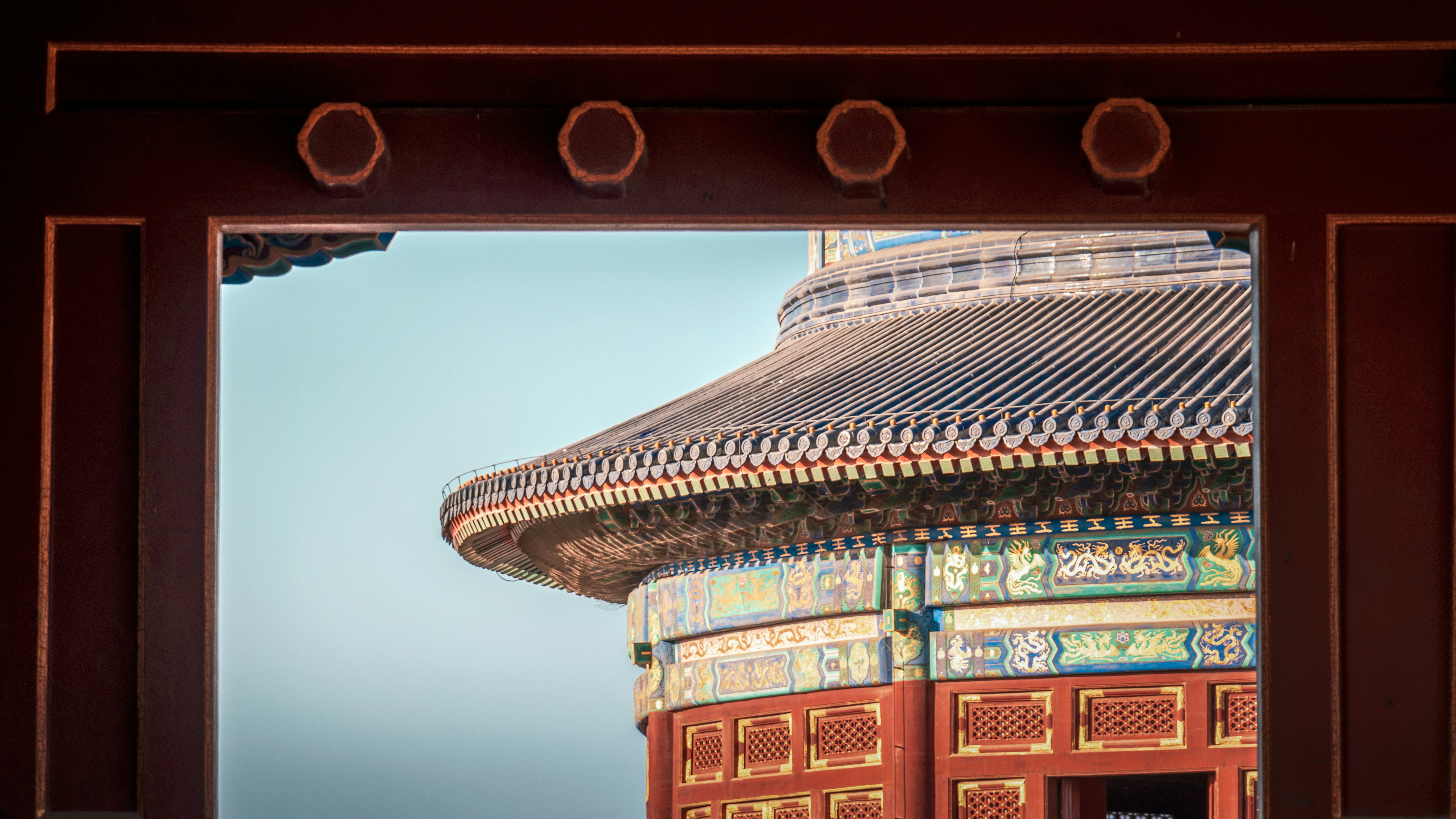 A view of a building through a window photo – Free Building Image on ...