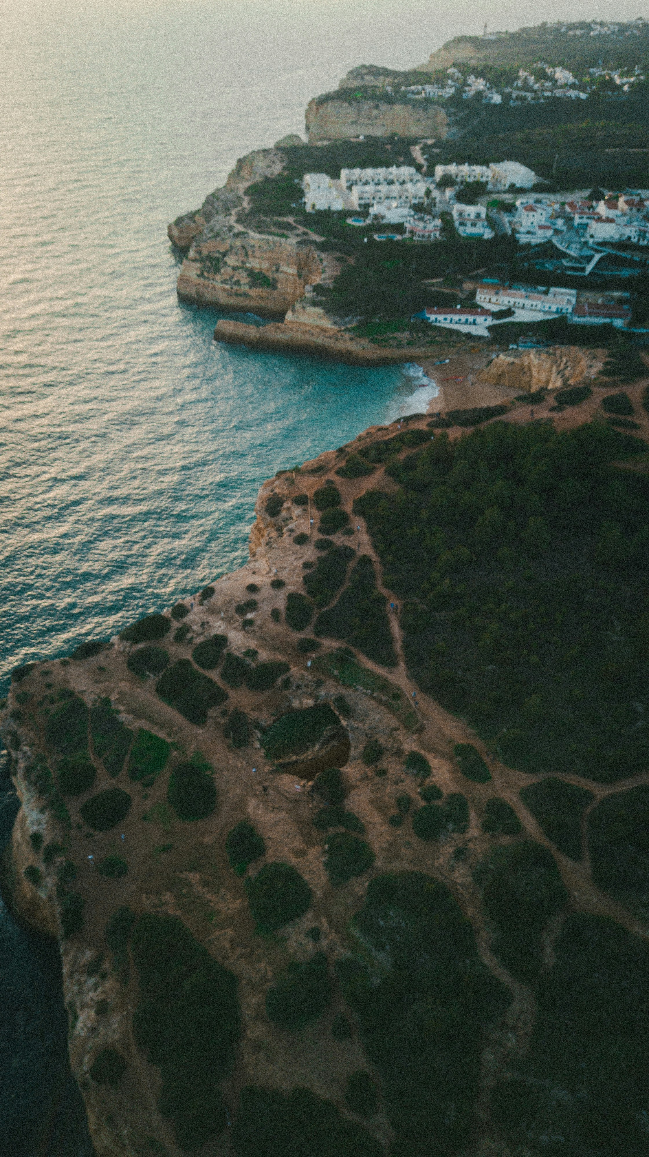 an aerial view of a small town on the coast
