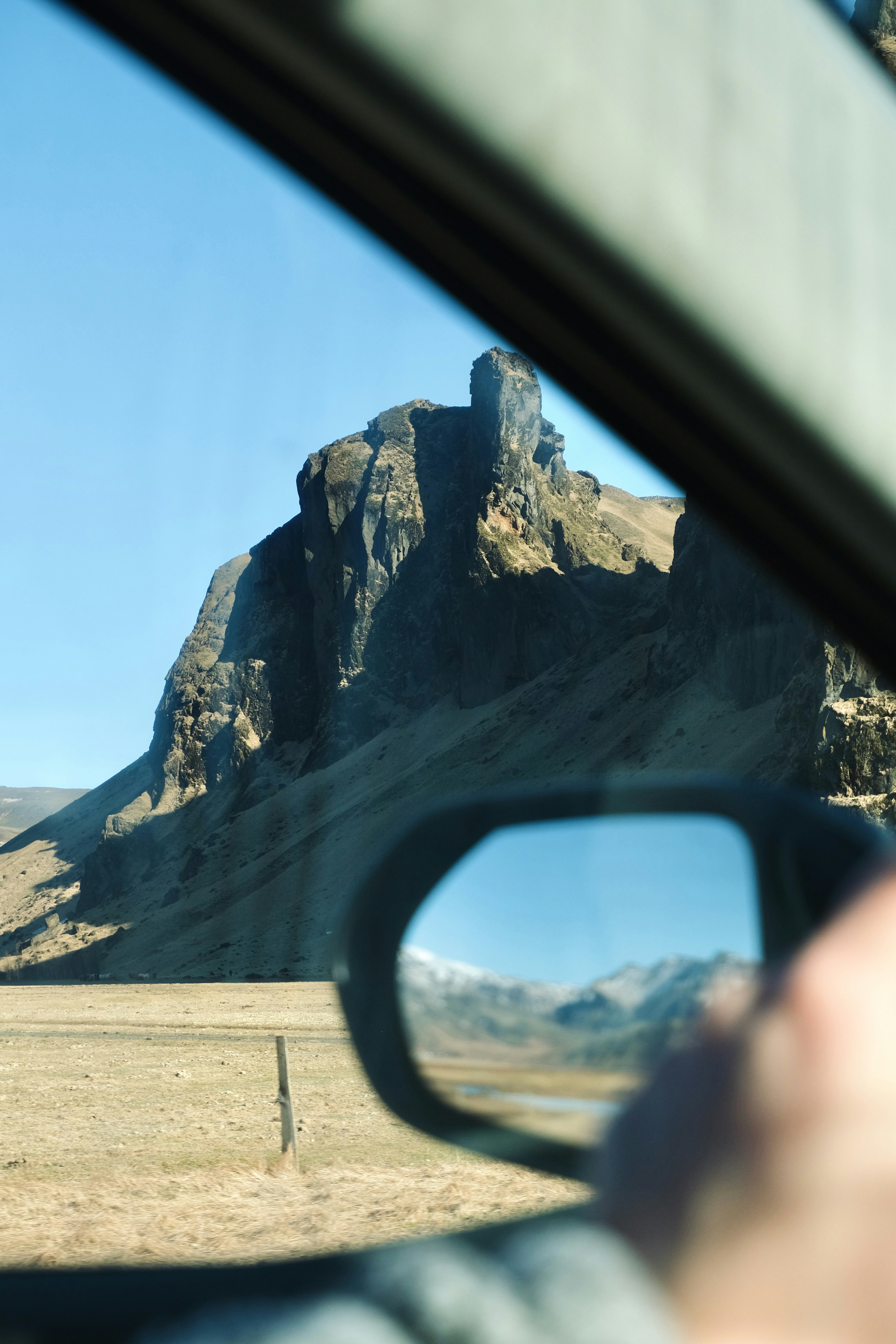 Rugged Peak Framed in a Car Window