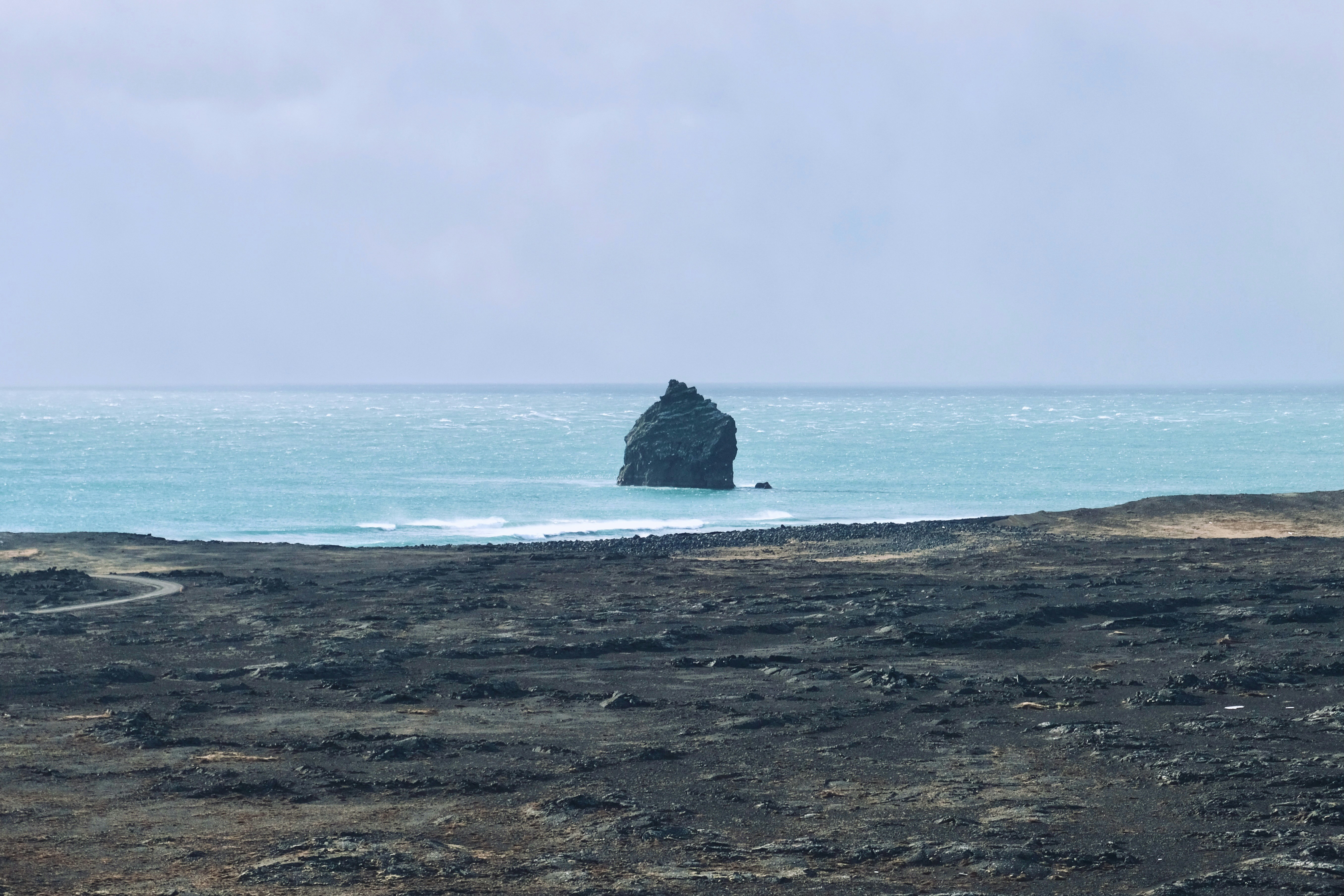 lonely rock in he ocean, South Iceland