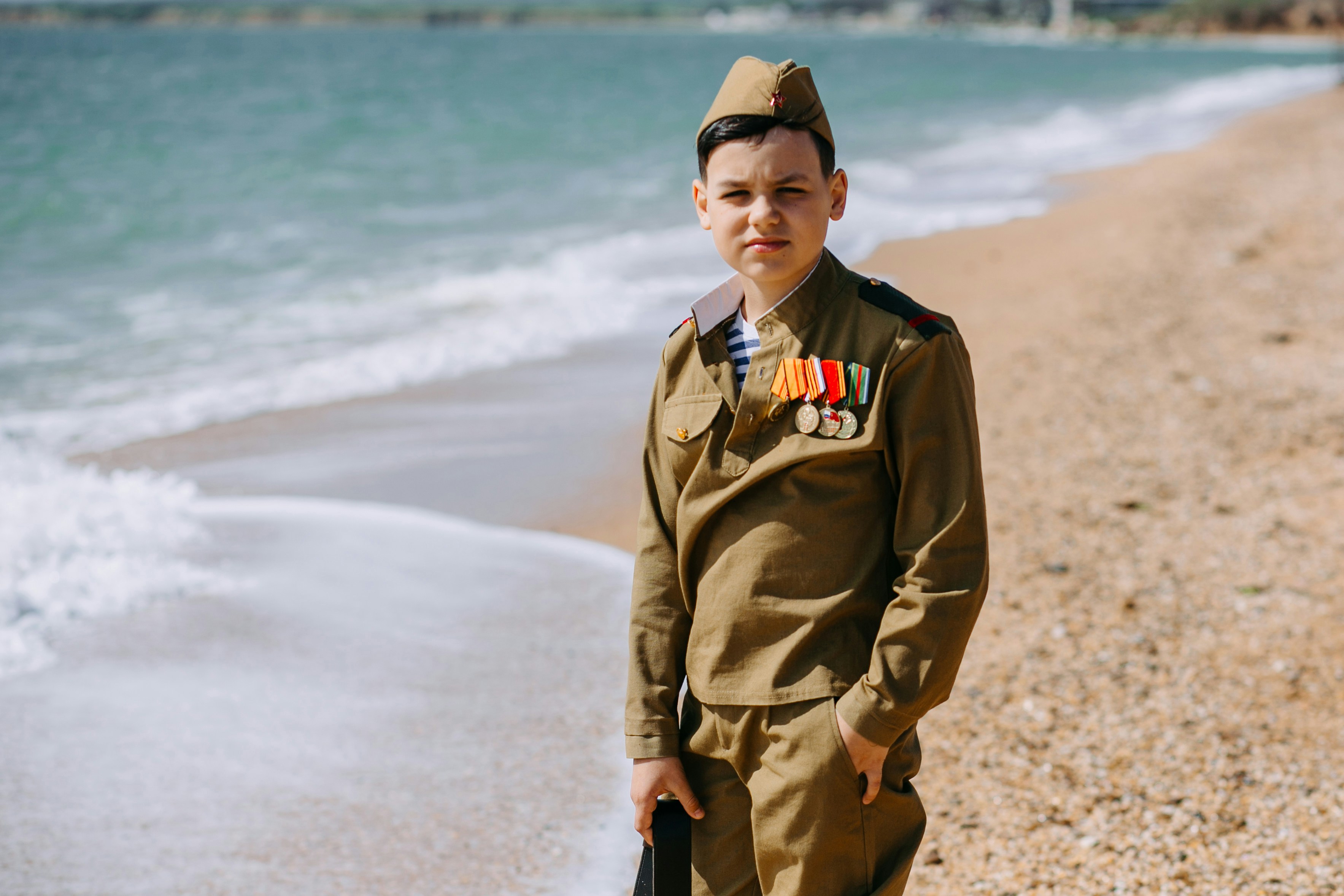 Quiet Valor by the Shore: A Young Veteran Stands Proud