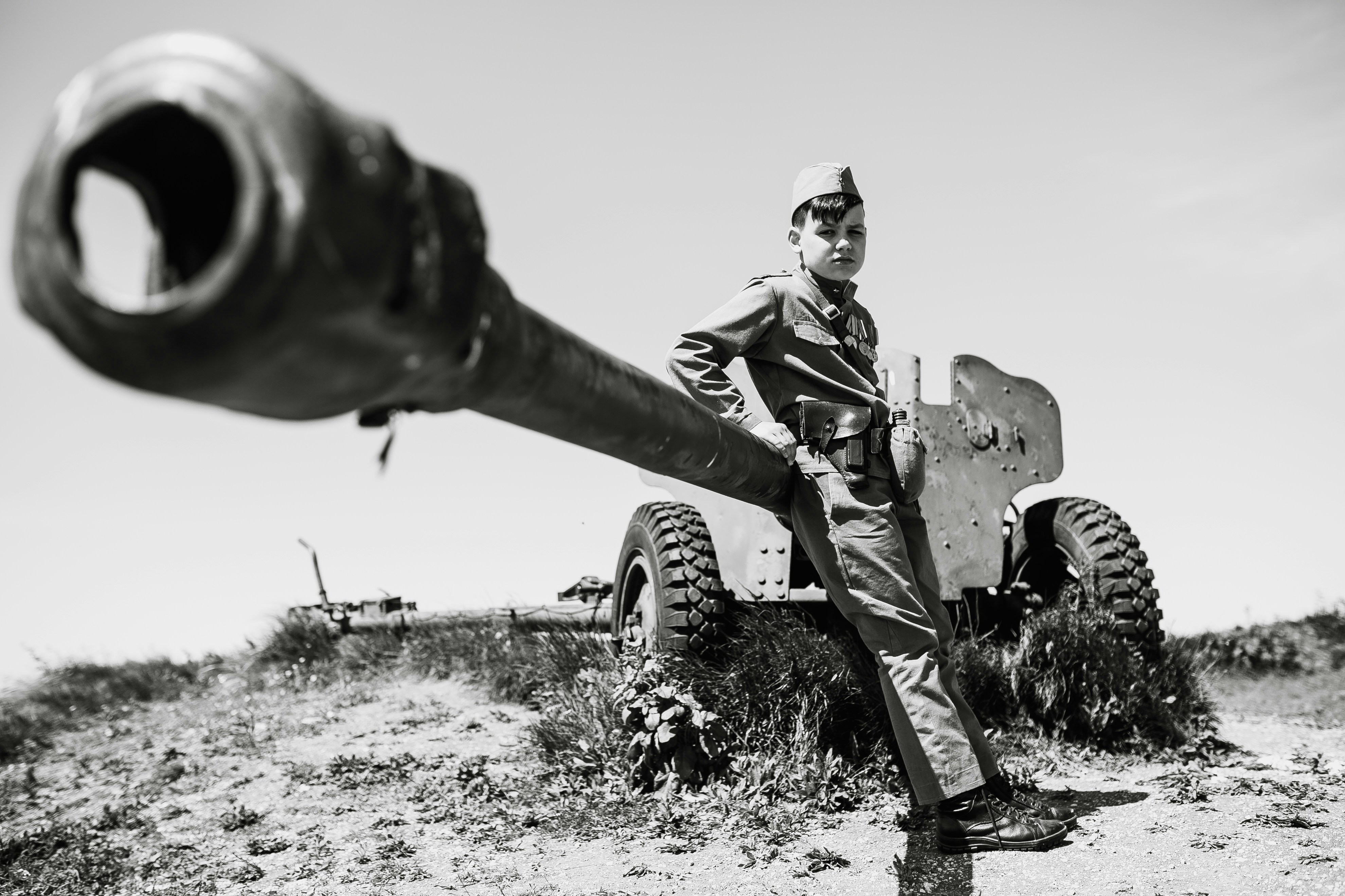 Child at the Turret: a Quiet Moment Beside a Battle Engine