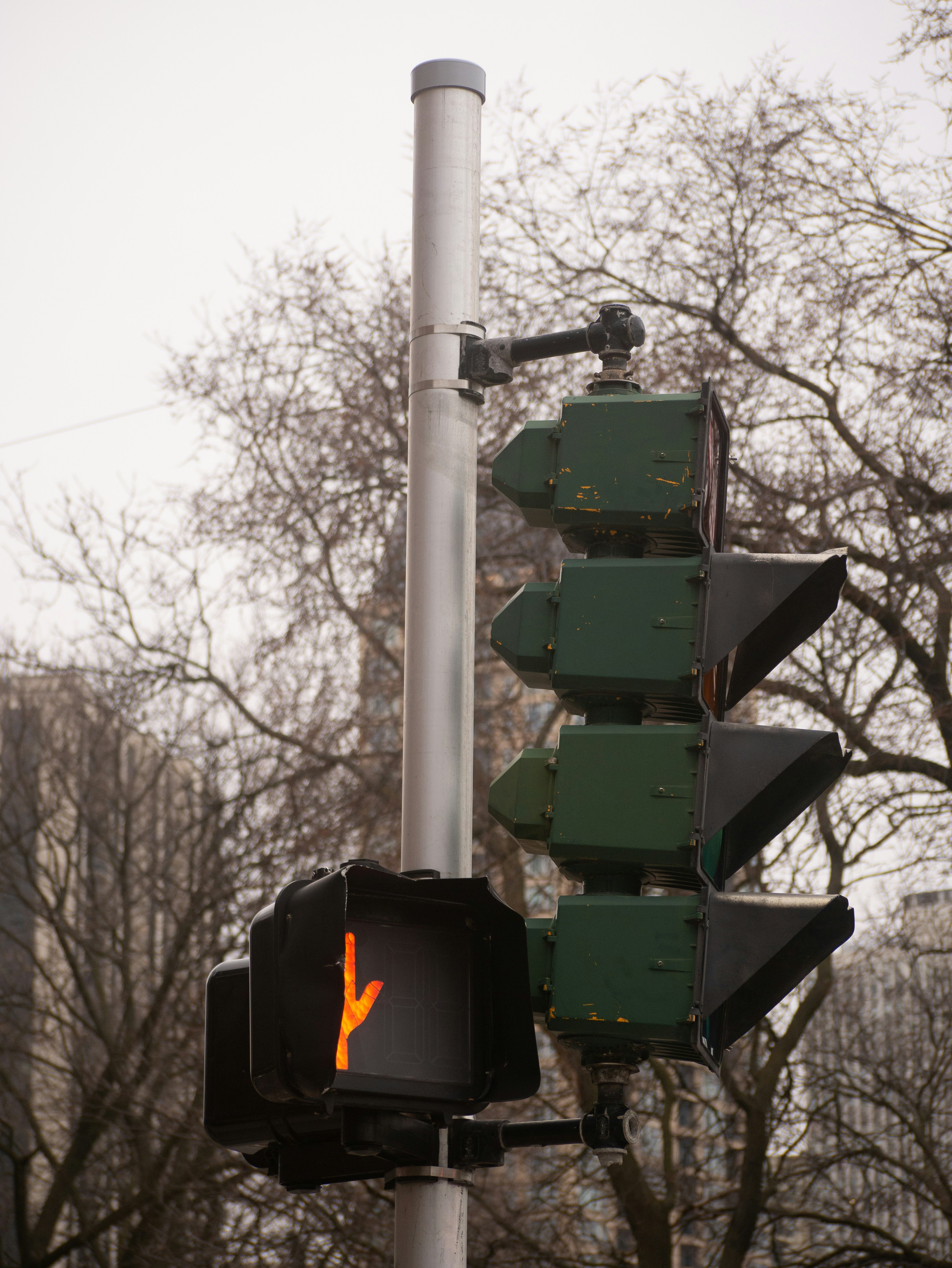 Amber Hand at the Crossing: A Winter Urban Signal Stack