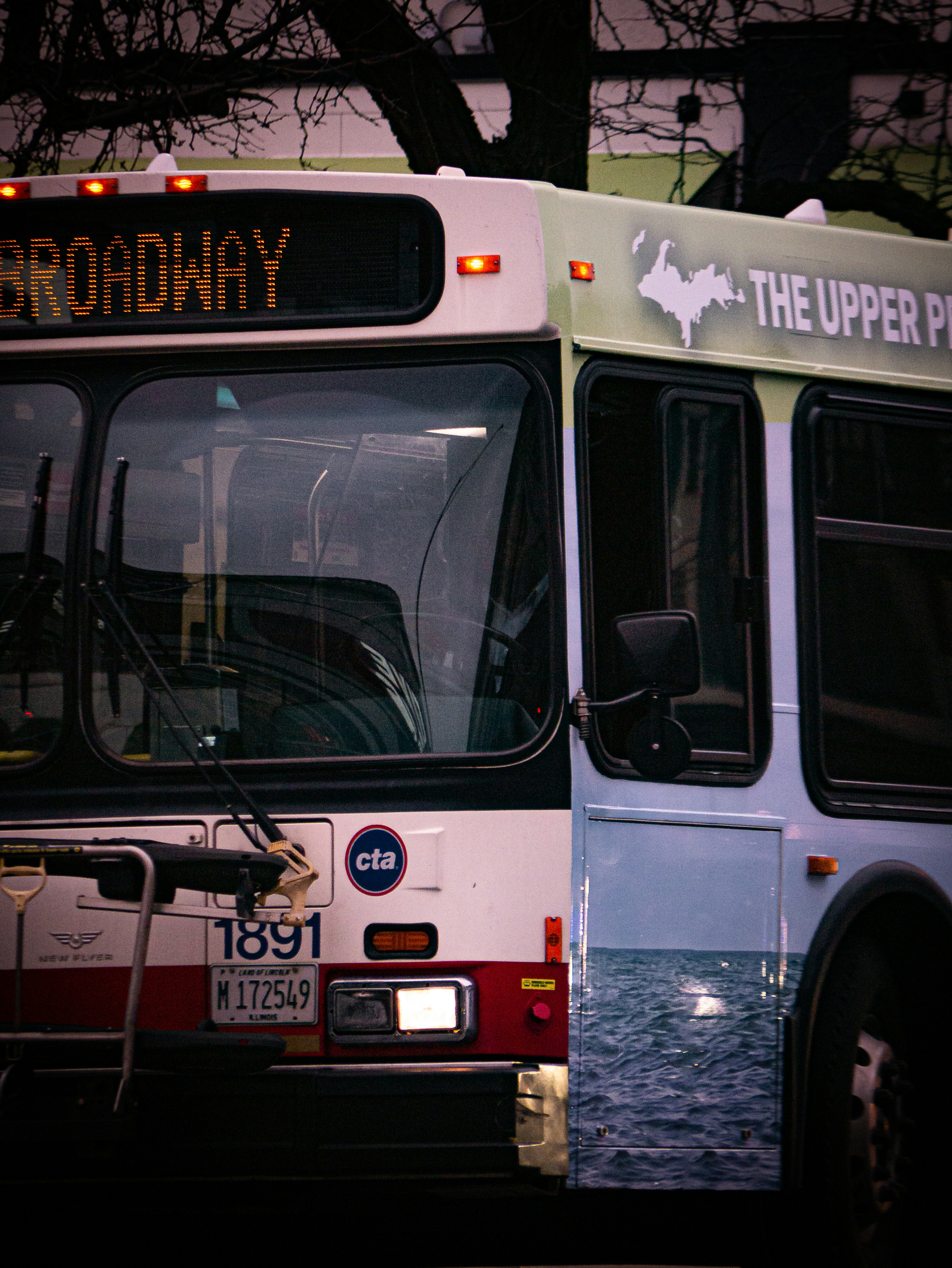 A city bus parked on the side of the road photo – Free Chicago Image on ...