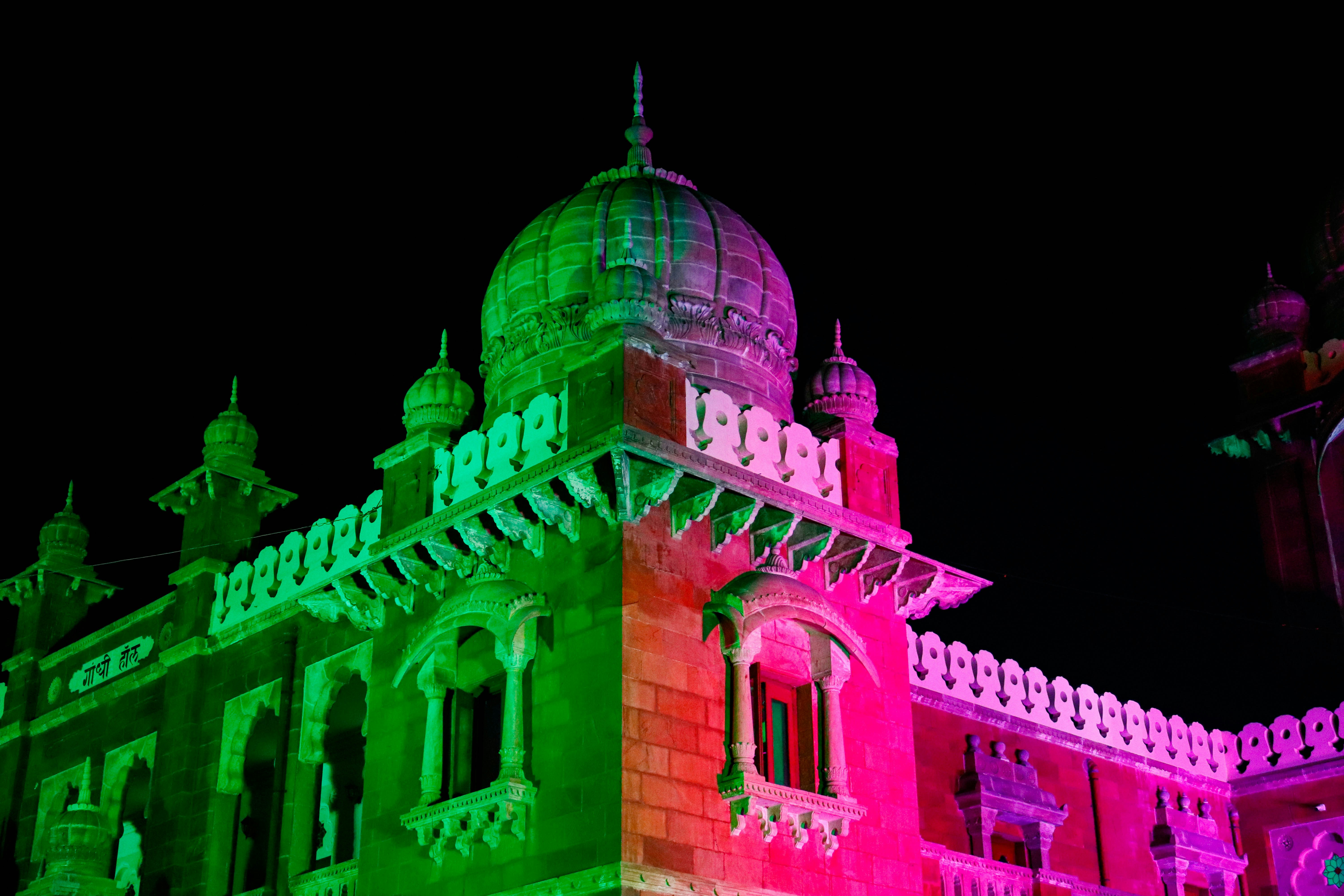 Moonlit Castles: Night-green and magenta on a historic facade