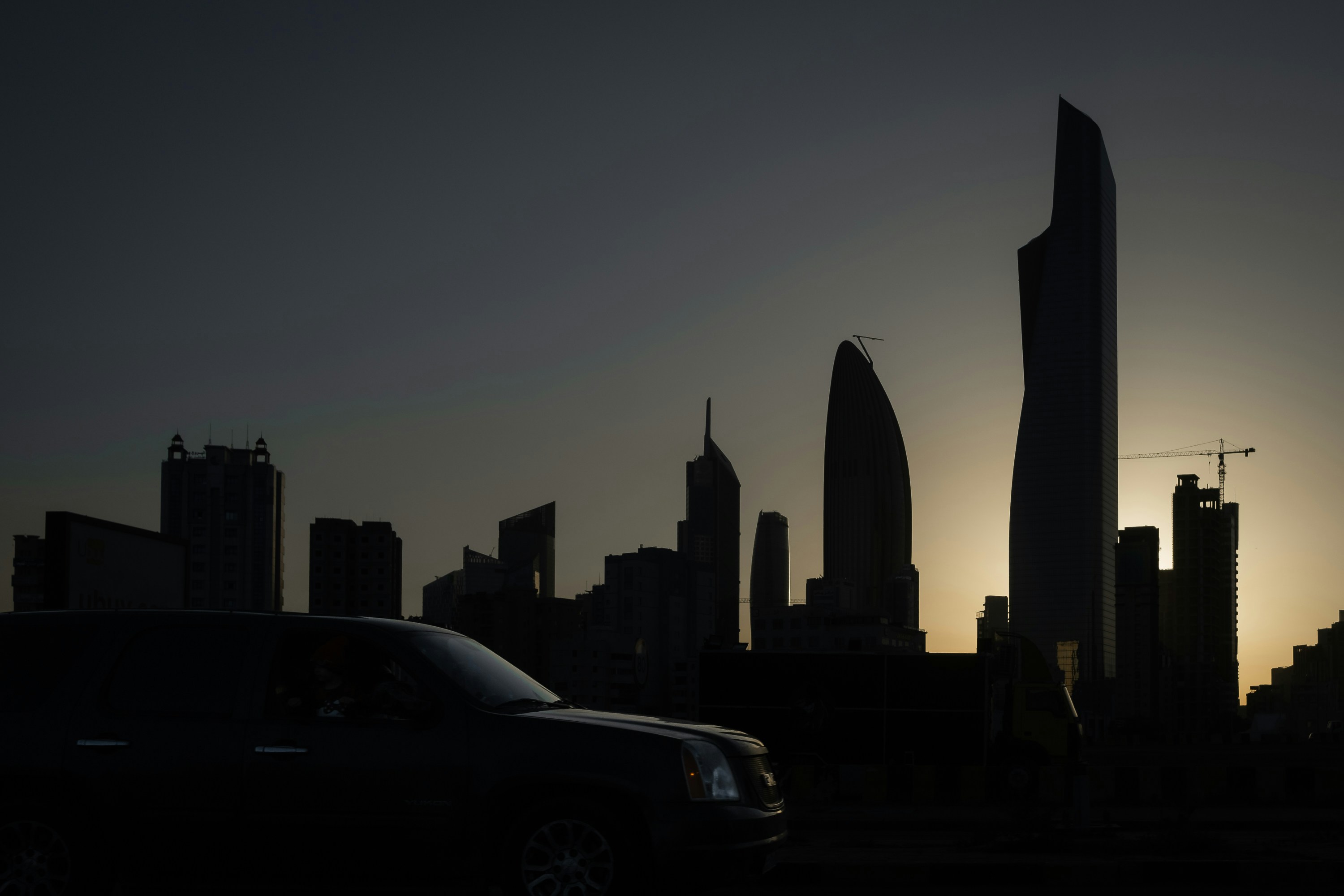 A city skyline with tall buildings at sunset photo – Free Panorama ...