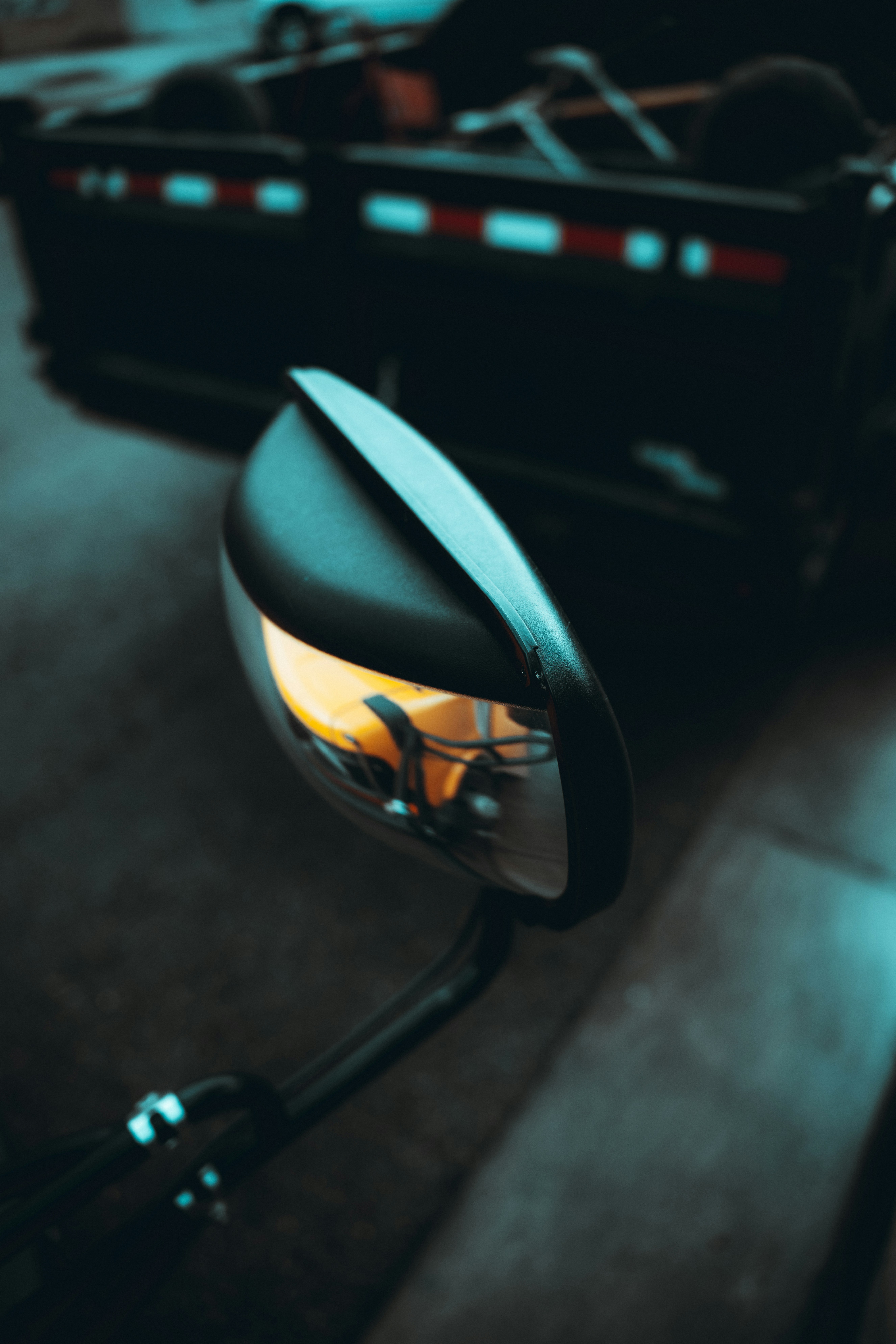 Urban Echo in a Mirror: Close-Up of a Motorcycle Side Mirror