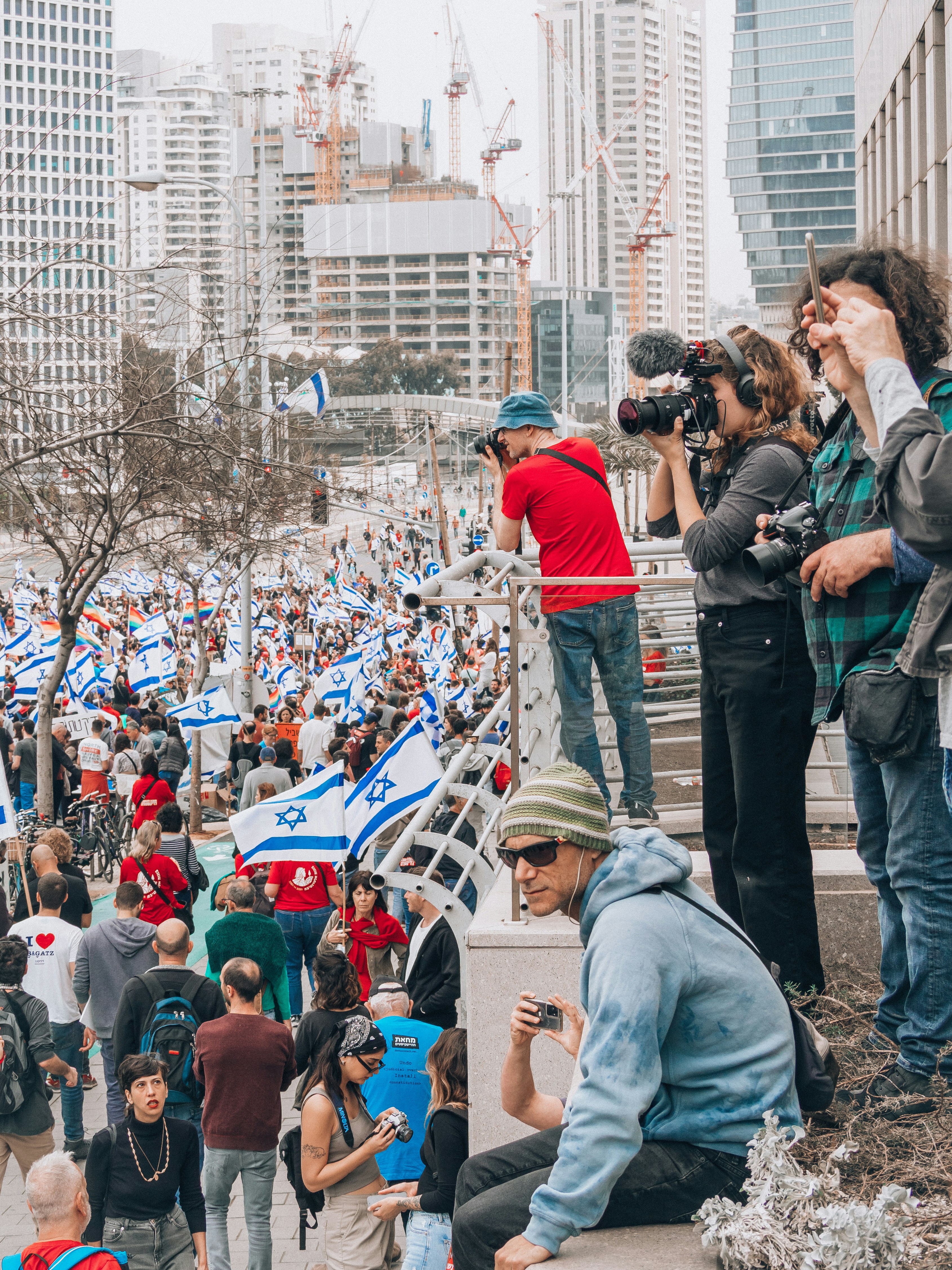 Stand Watch: Photographers Guard the Rally from the Railing