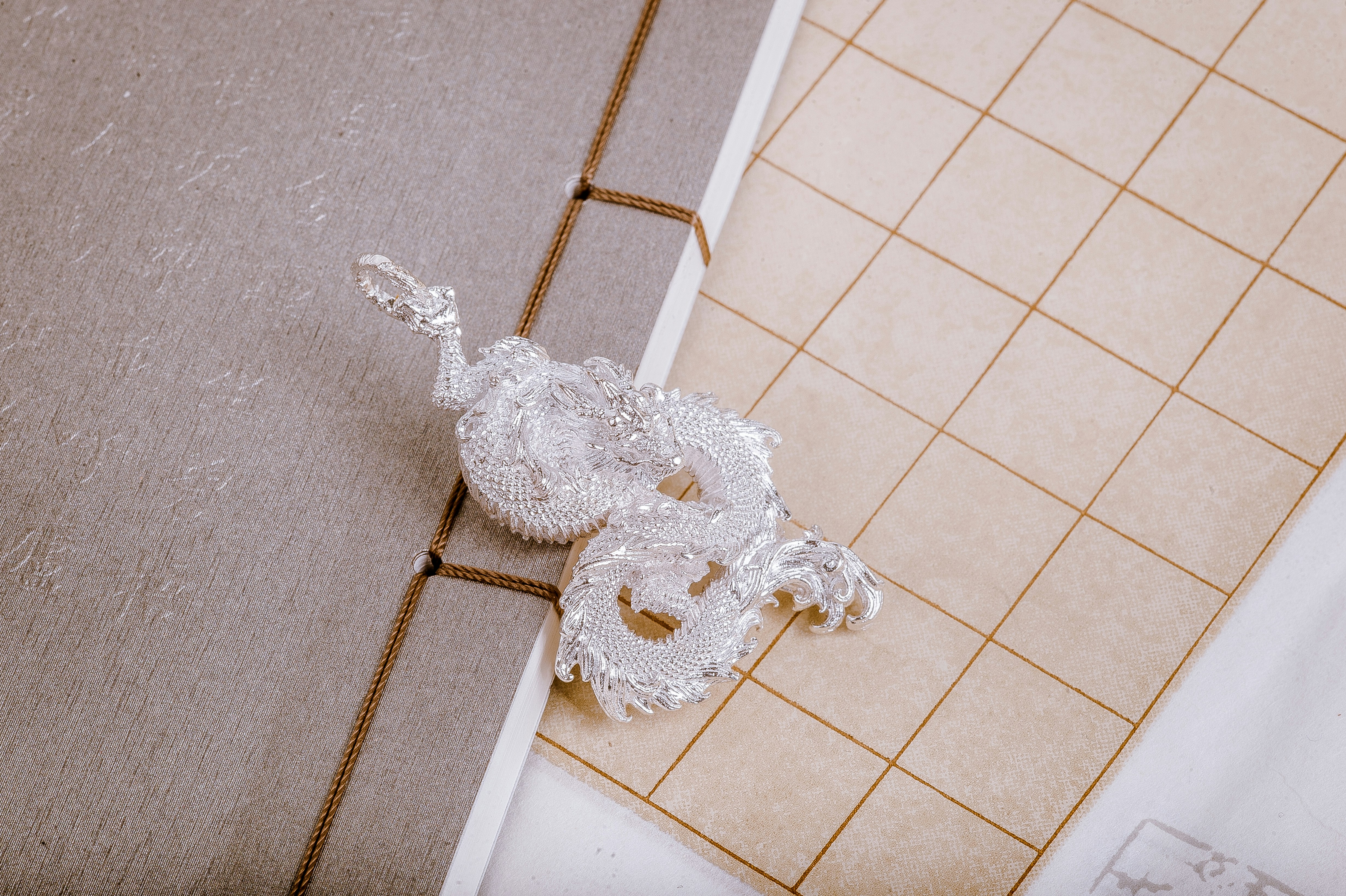 Beaded Serpent on the Carpet-Tile Threshold