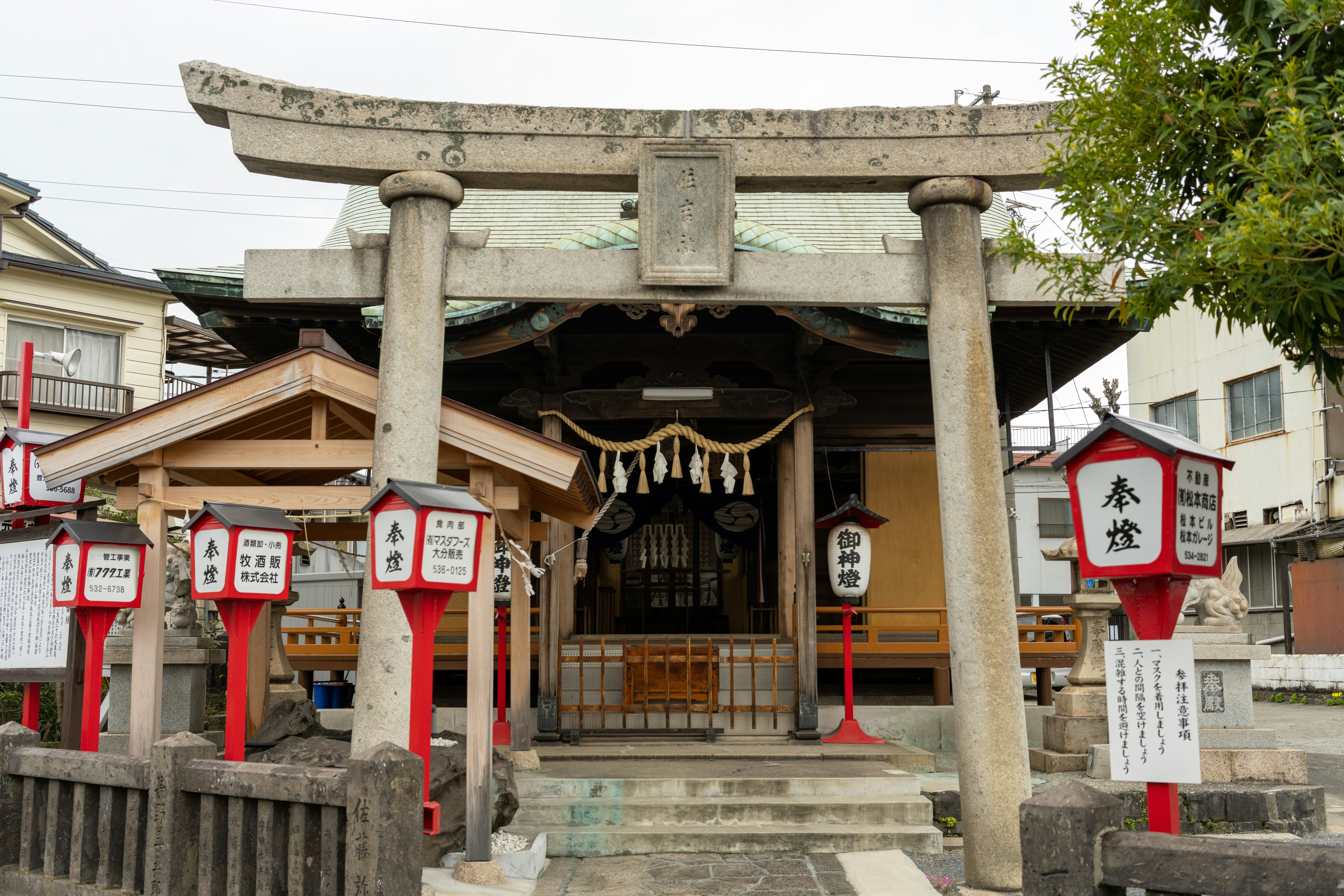 A small shrine with red and white decorations photo – Free Building ...