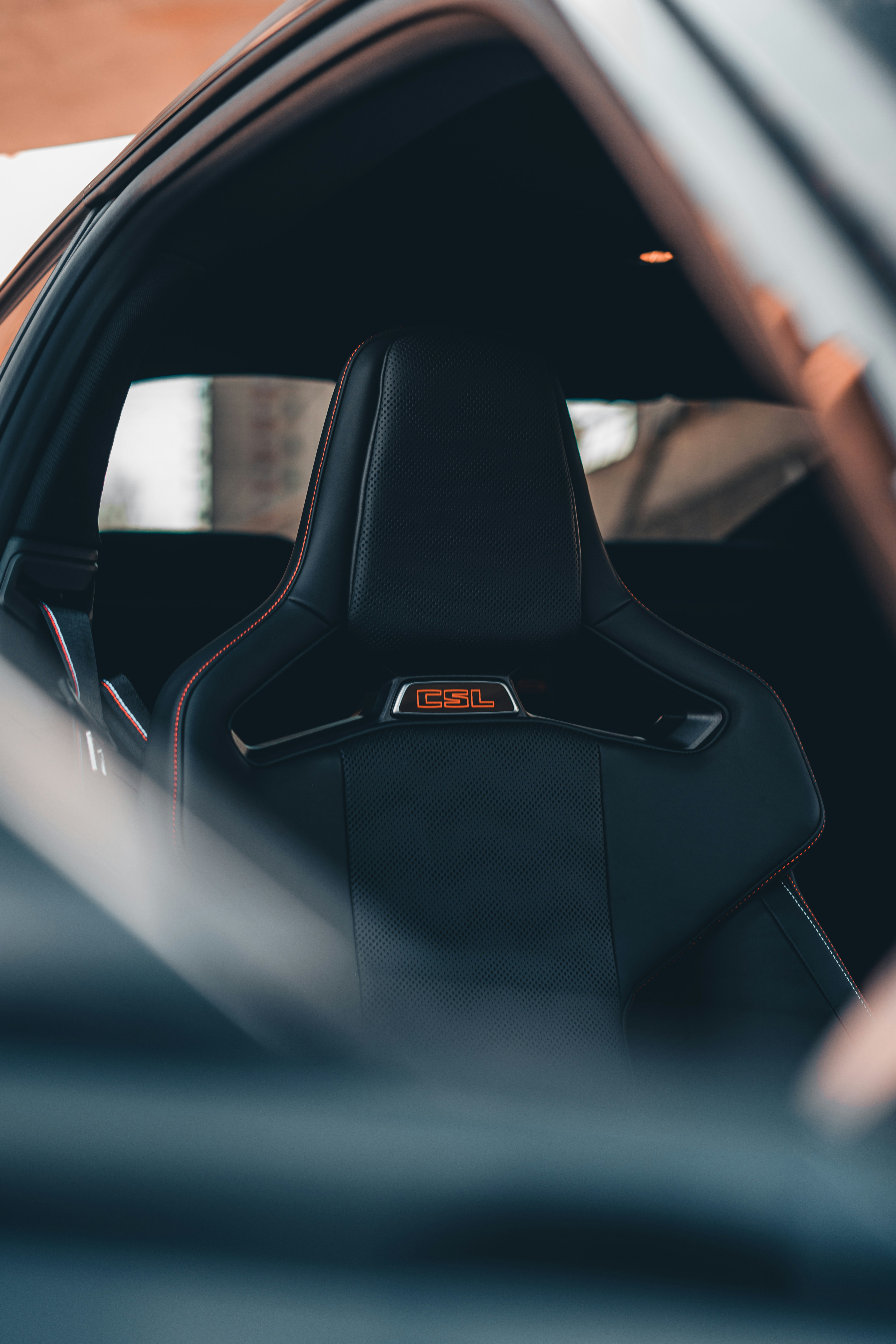 CSL Emblem in Focus: A Close-Up of a Racing-Style Car Seat