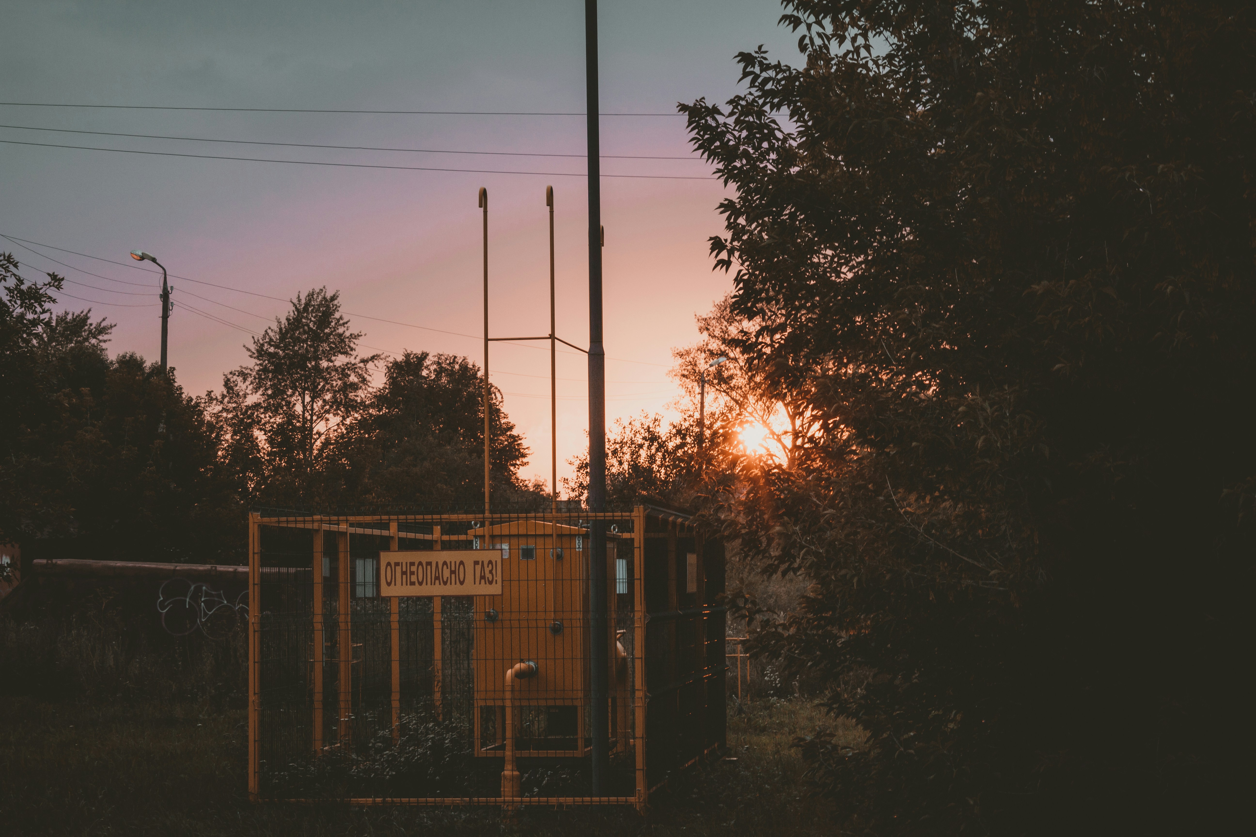 Dusk Guard: A Quiet Industrial Moment Behind the Fence